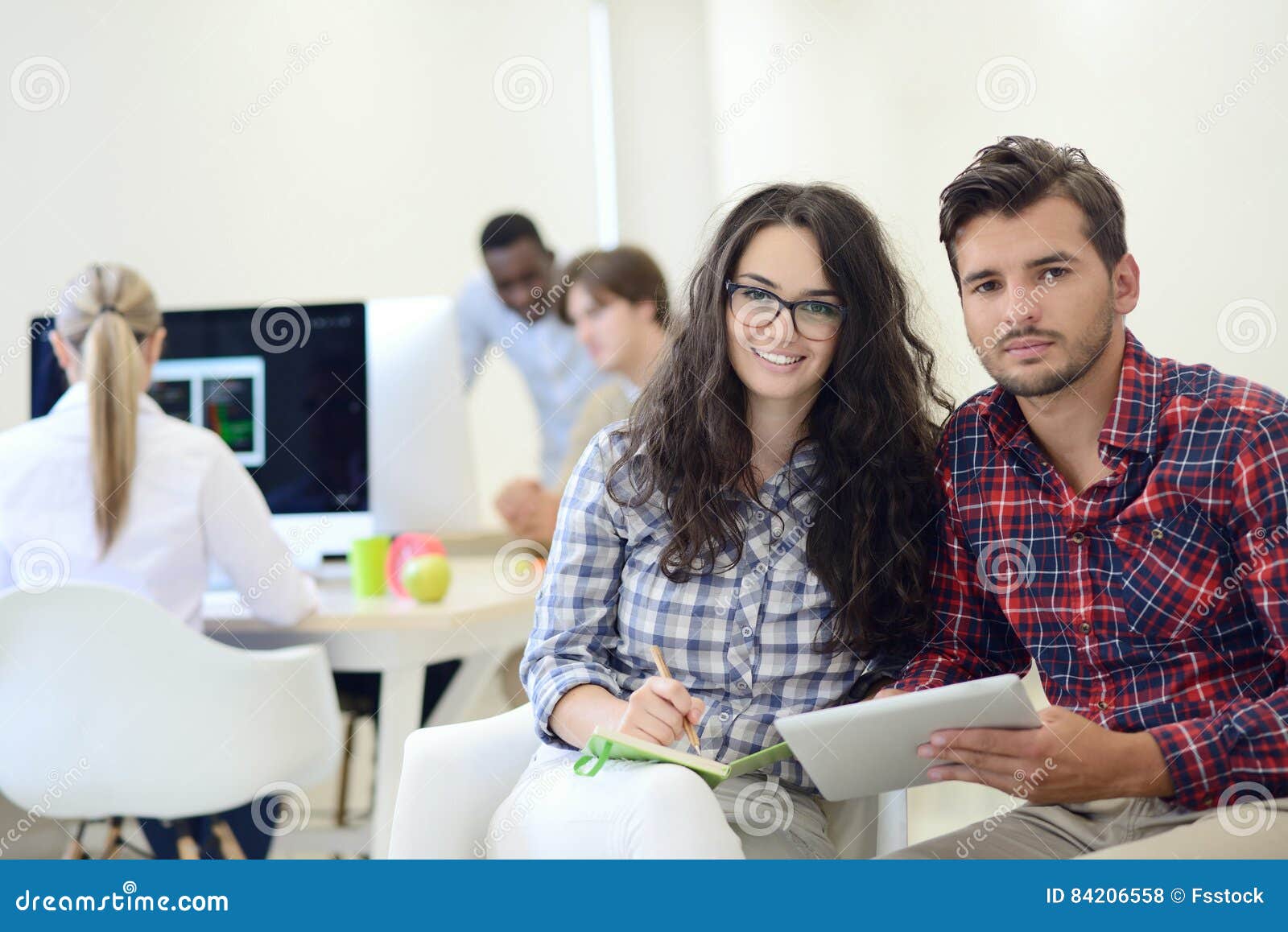 Business Couple Working Together on Project at Modern Startup Office ...