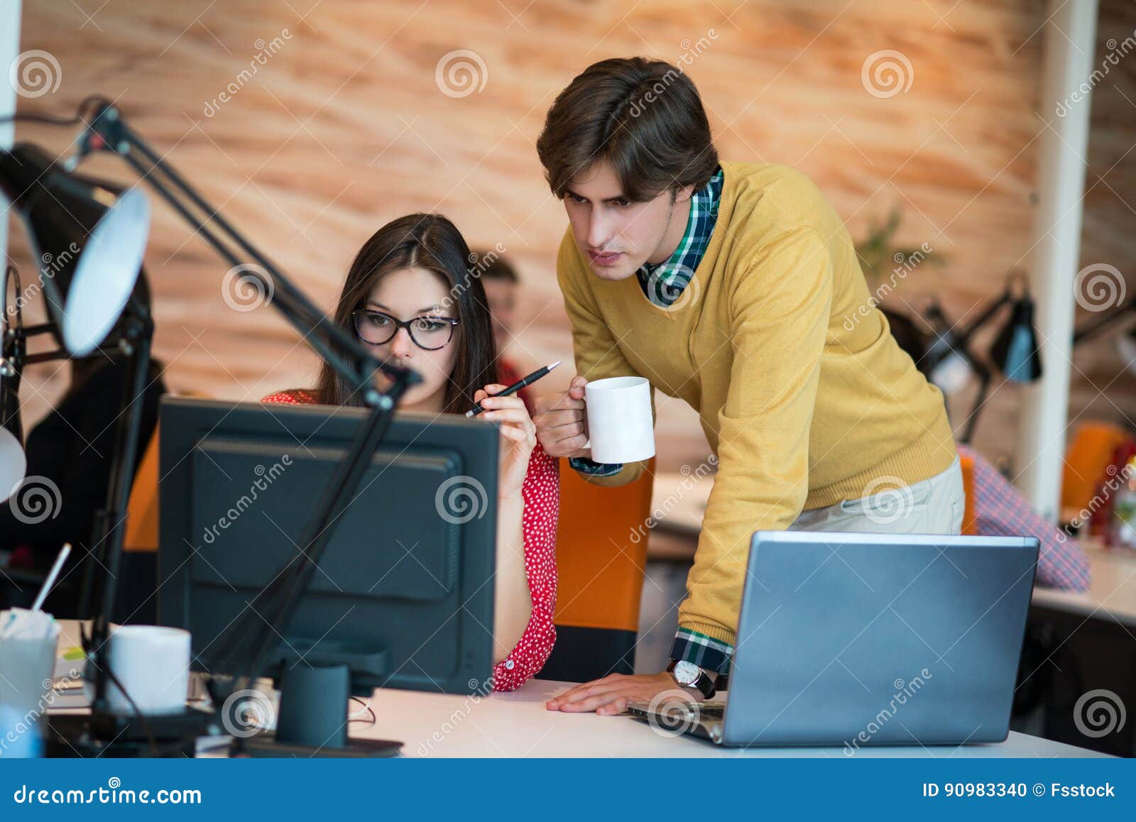 Business Couple Working Together on Project at Modern Startup Office ...