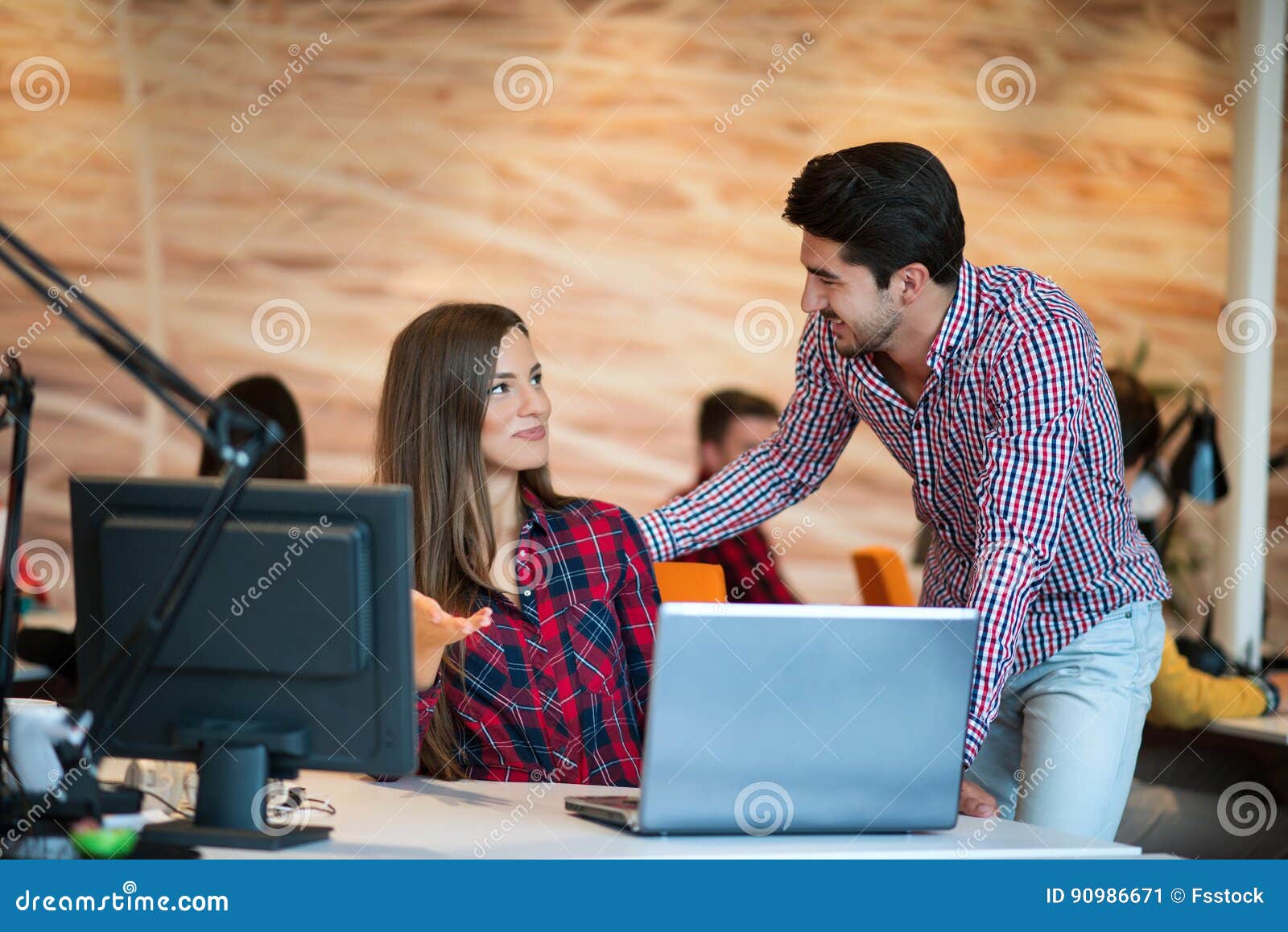 Business Couple Working Together on Project at Modern Startup Office ...