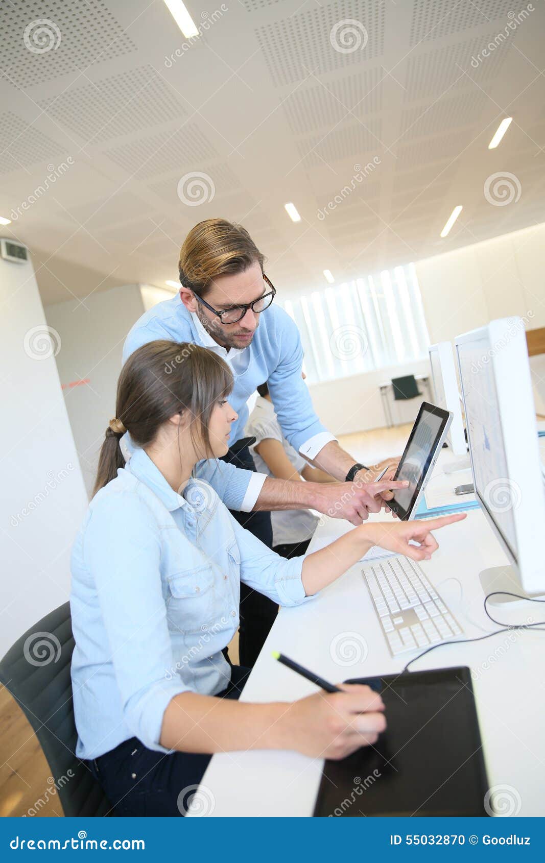 Business Coworkers at Office Working on Tablet and Computer Stock Photo ...