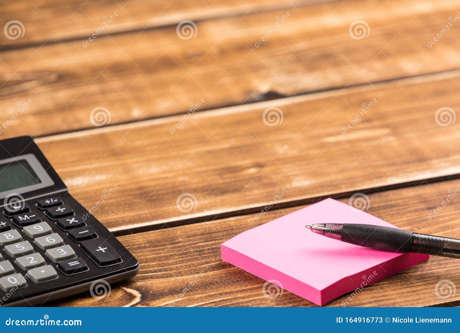 Business Desk with Calculator and Paper and Pen Stock Image - Image of ...