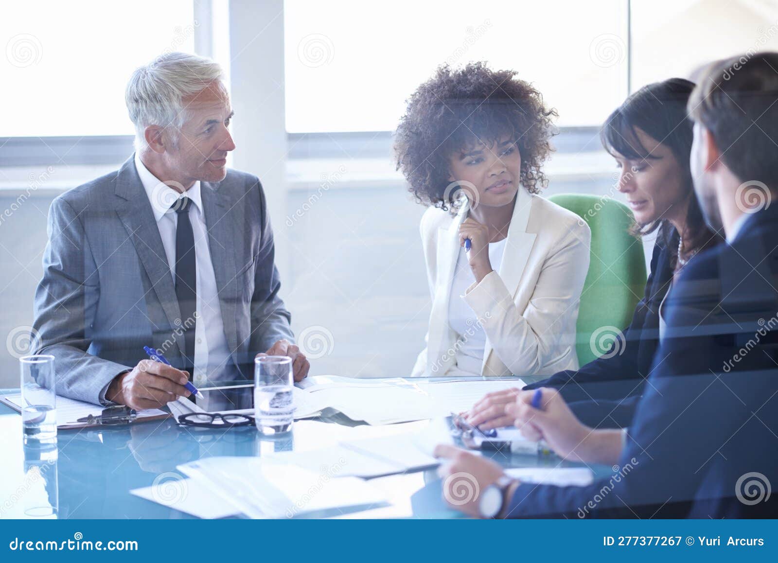 Business Discussions. a Group of Business Colleagues Meeting in the ...