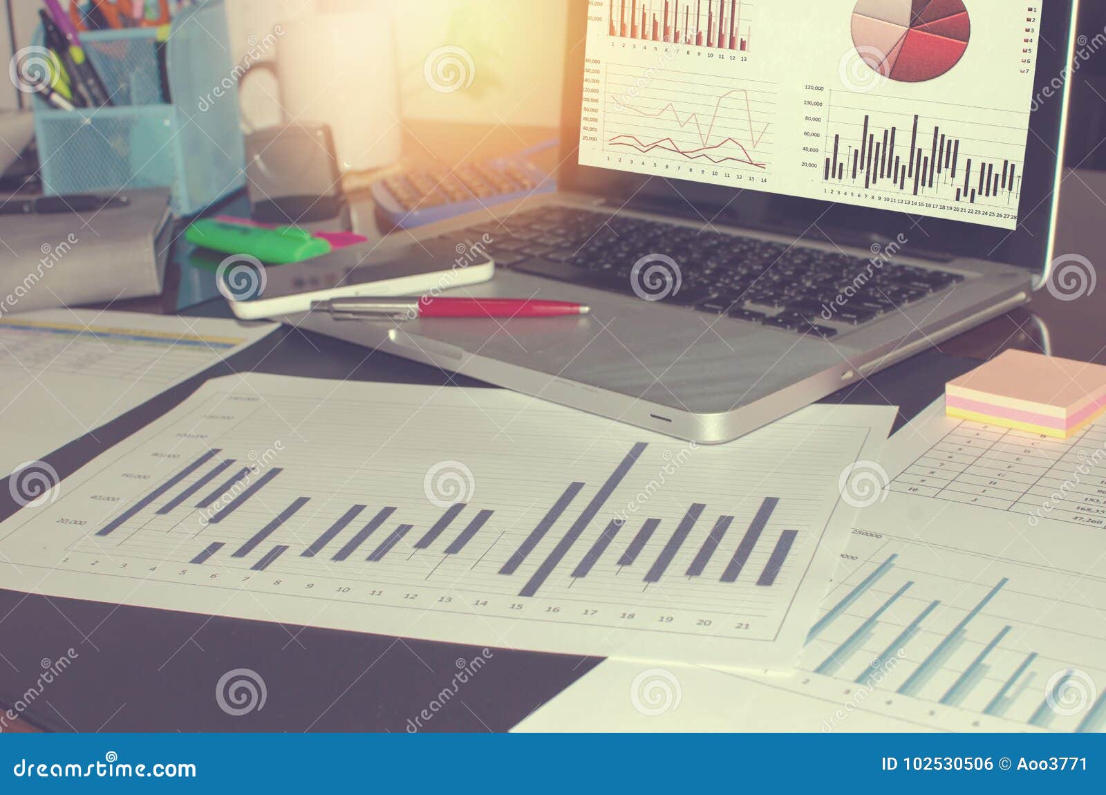 Business laptop and graph stock photo. Image of chart - 102530506