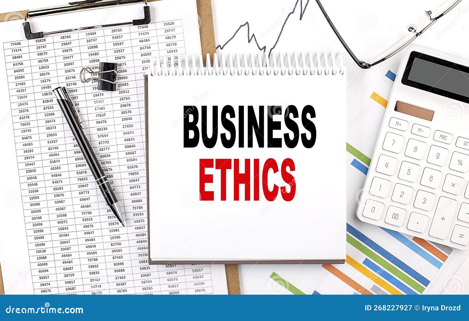 BUSINESS ETHICS Text on Notebook with Chart, Calculator and Pen Stock ...