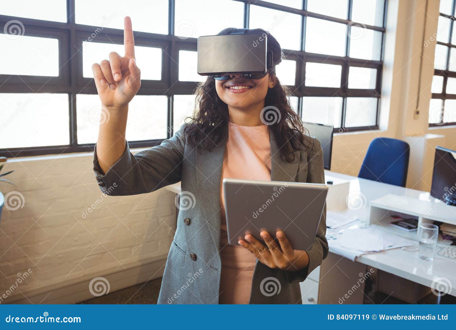 Business Executive Holding Digital Tablet while Using Virtual Reality ...