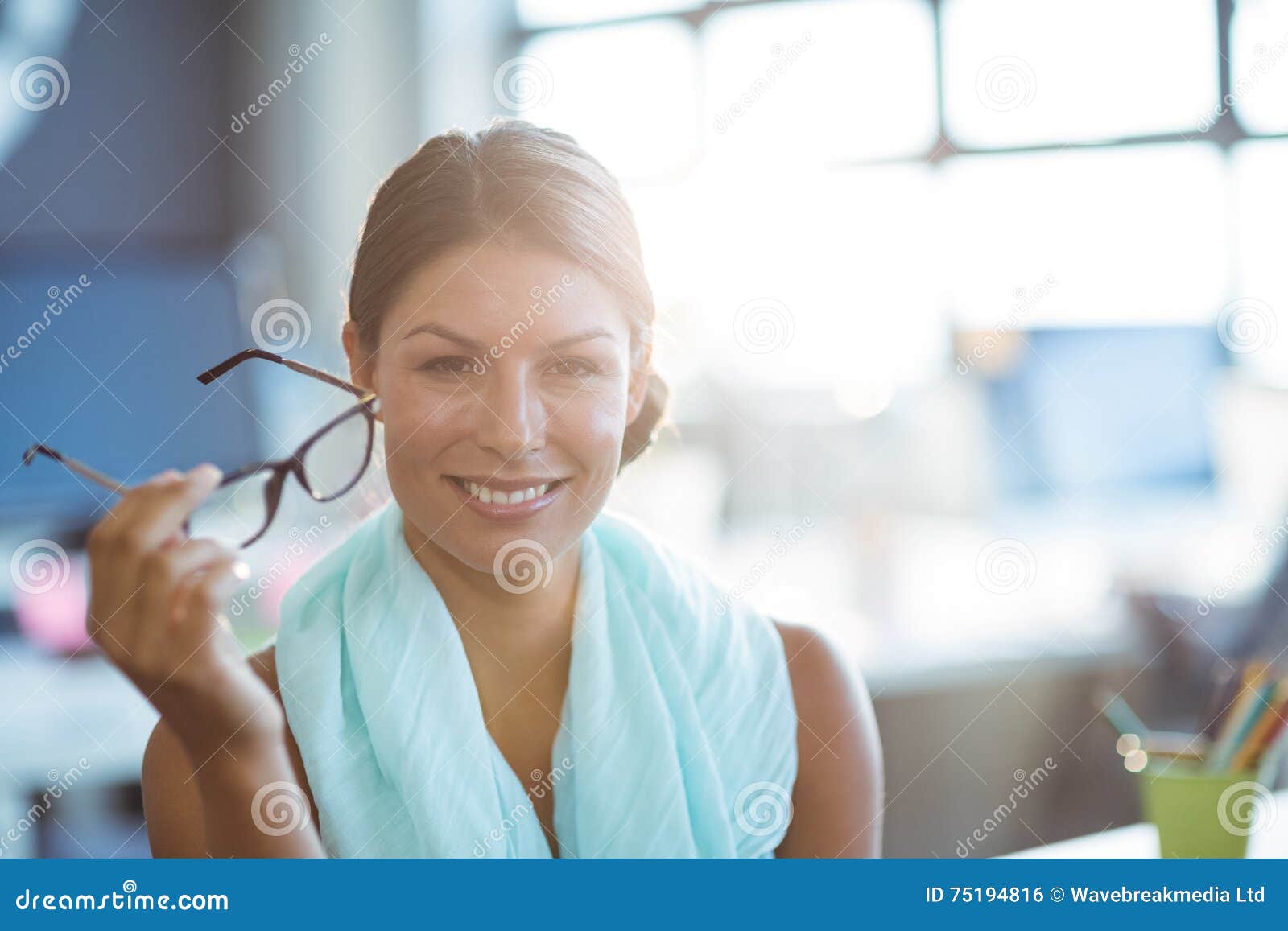 Business Executive Holding Spectacles in Office Stock Photo - Image of ...