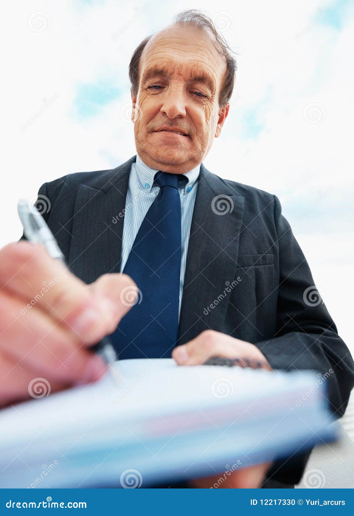 Business Executive Taking Notes on a Book Outdoors Stock Photo - Image ...