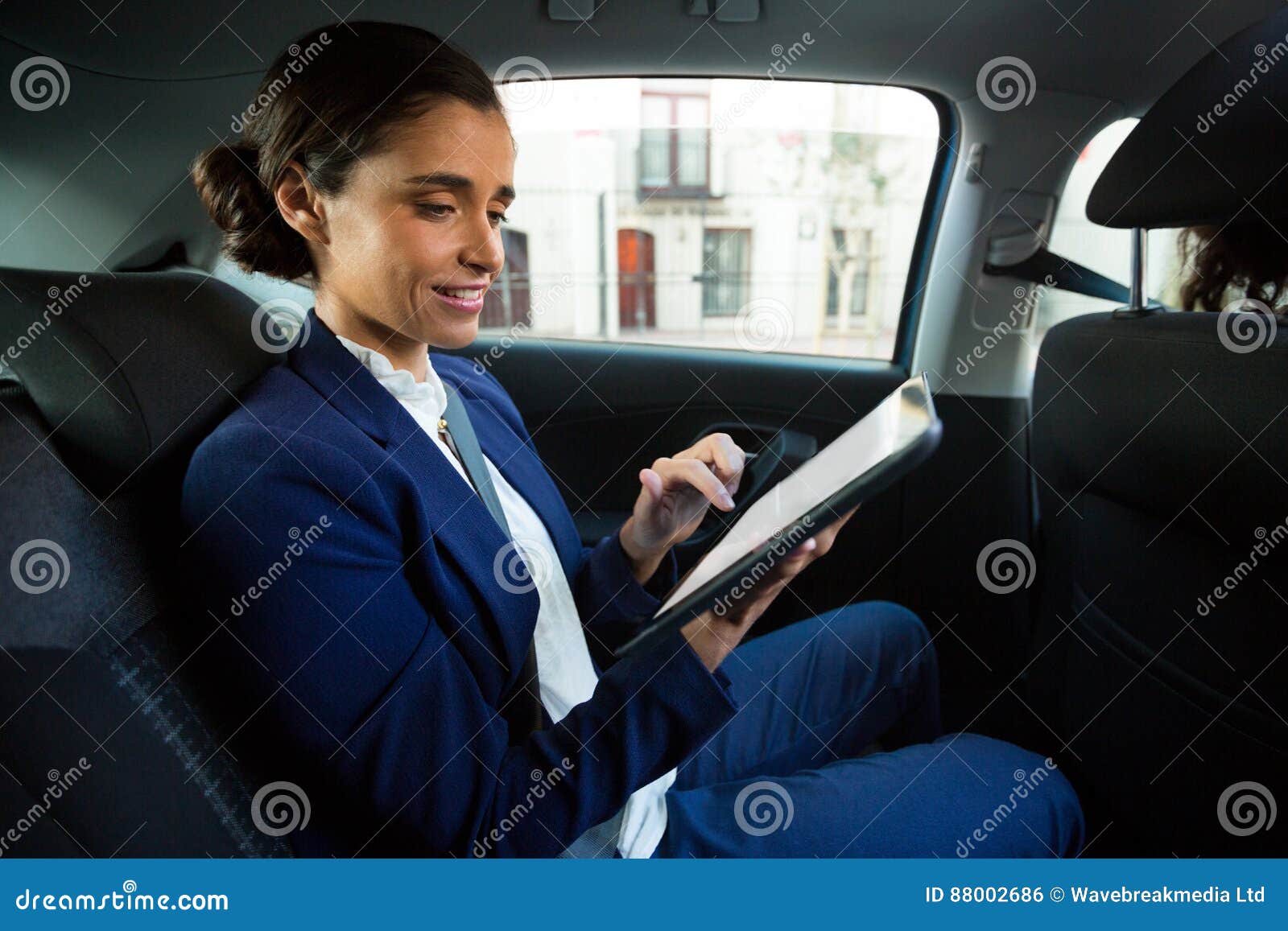 Business Executive Using Digital Tablet in Car Stock Photo - Image of ...