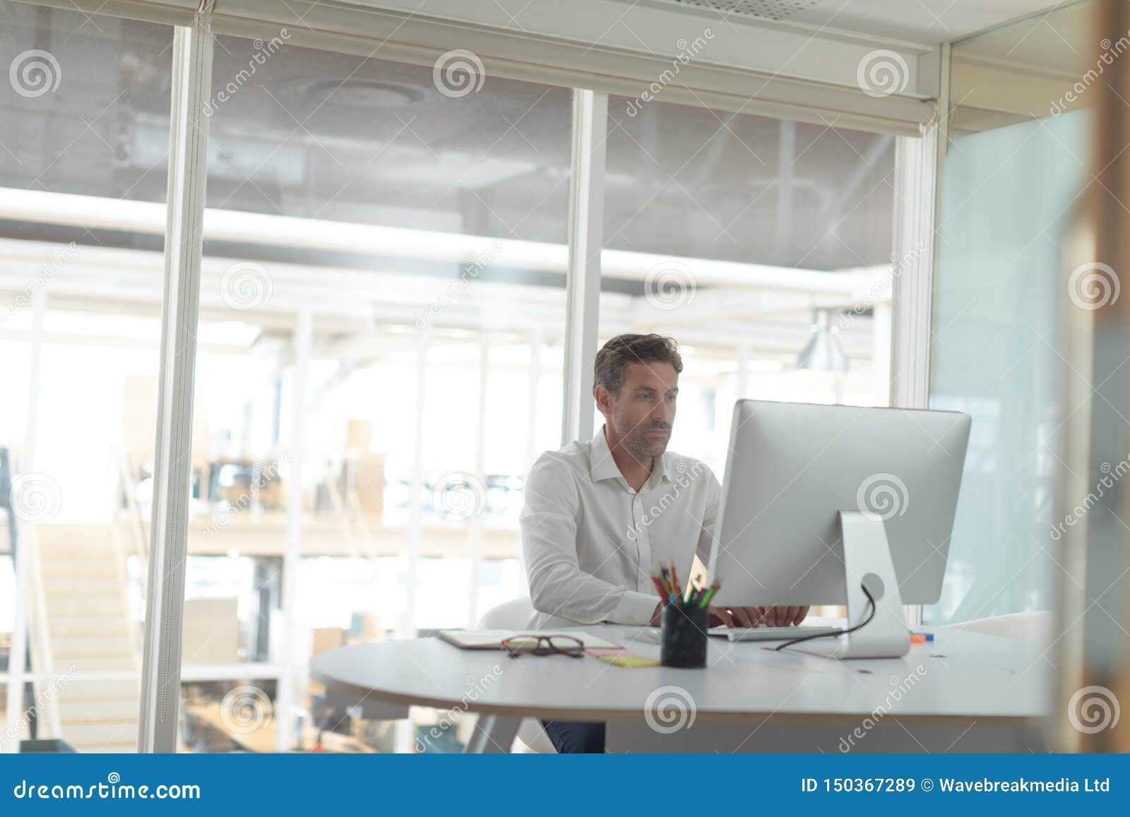 Business Executive Working on Computer at Desk in a Modern Office Stock ...