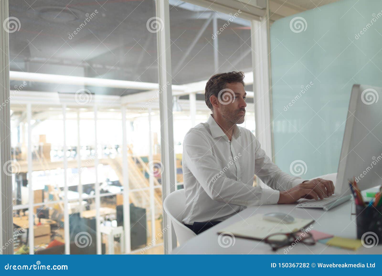 Business Executive Working on Computer at Desk in a Modern Office Stock ...