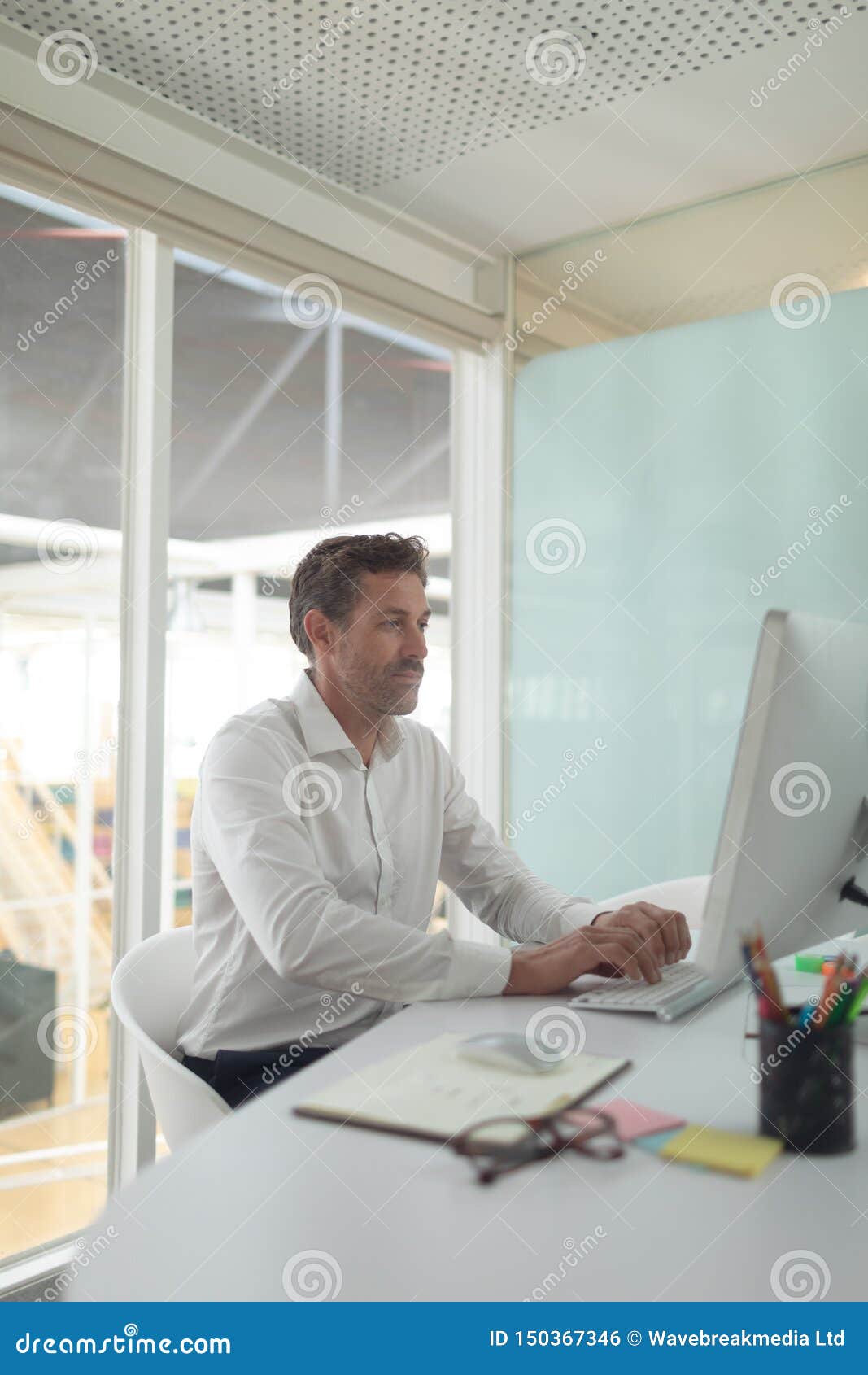 Business Executive Working on Computer at Desk in a Modern Office Stock ...