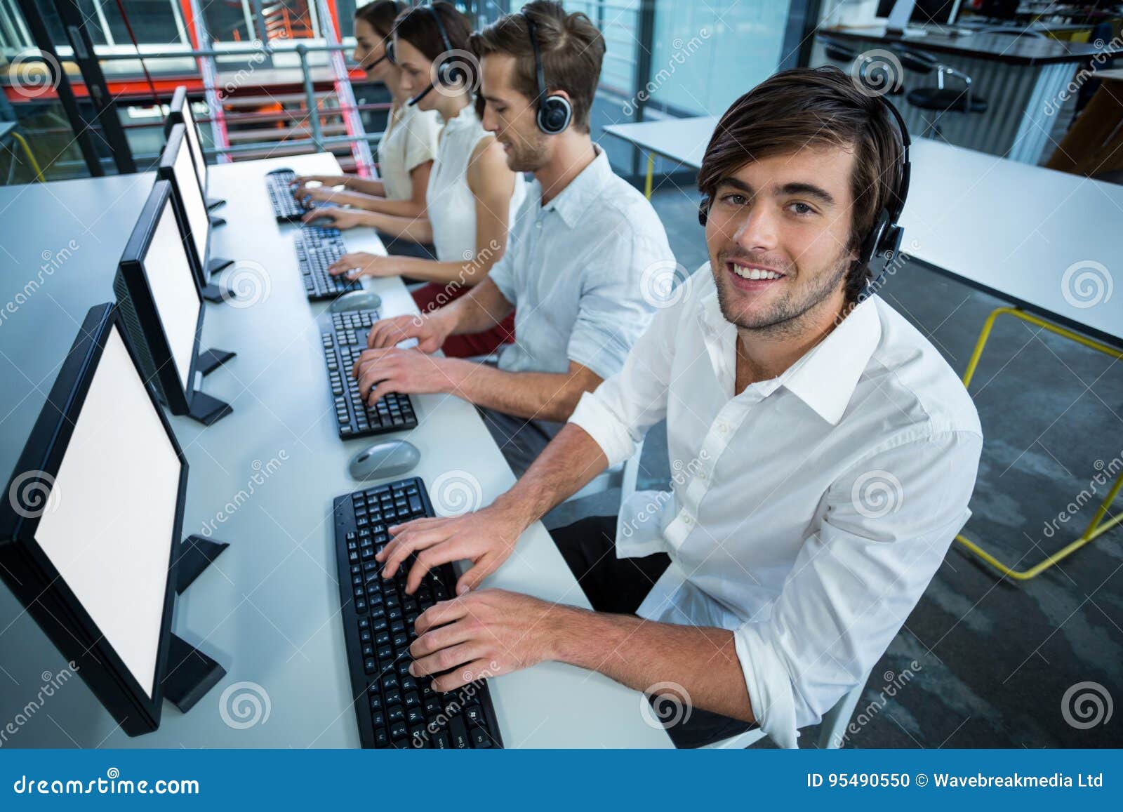 Business Executives with Headsets Using Computer Stock Photo - Image of ...