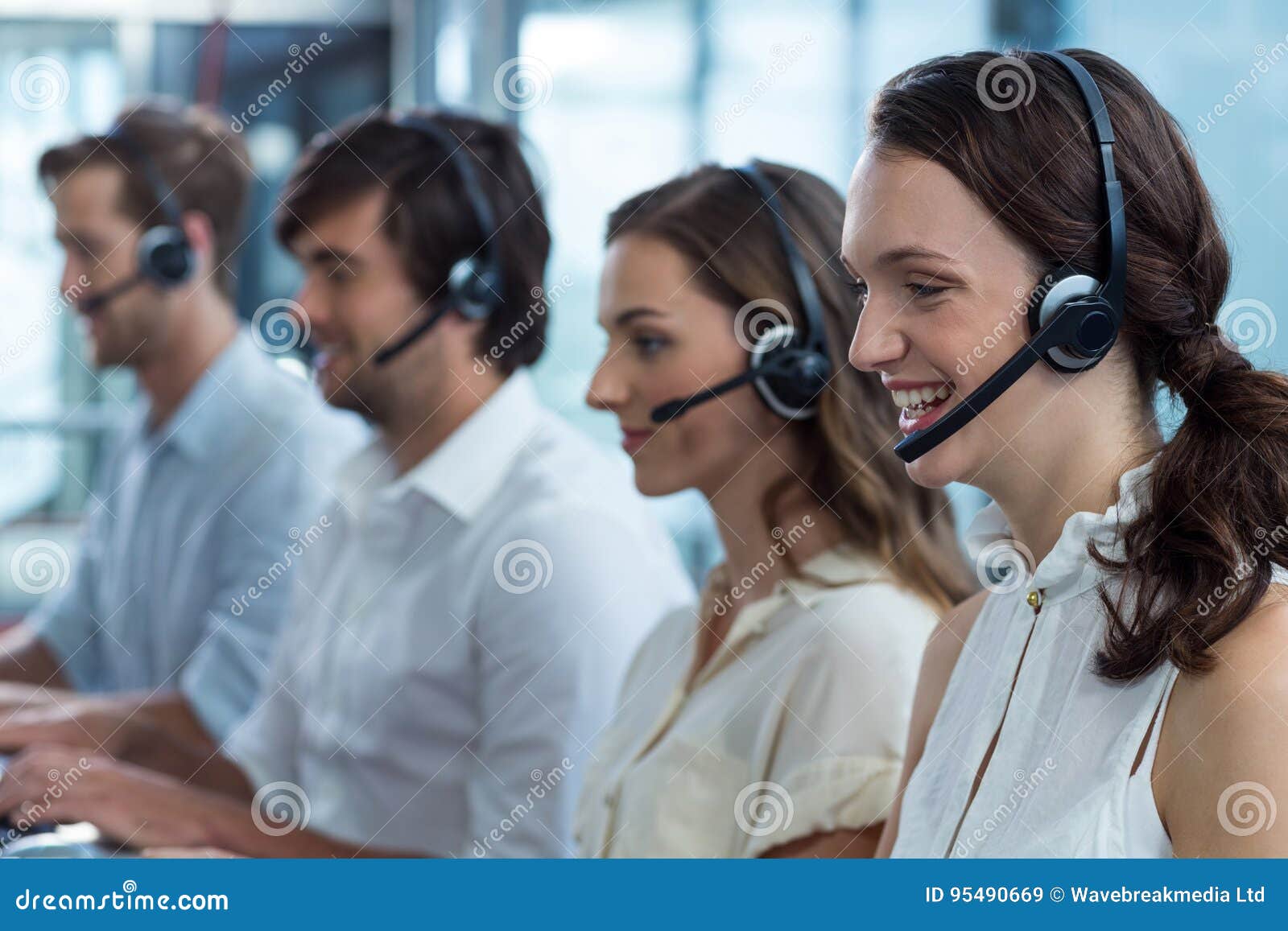 Business Executives with Headsets Using in Office Stock Image - Image ...