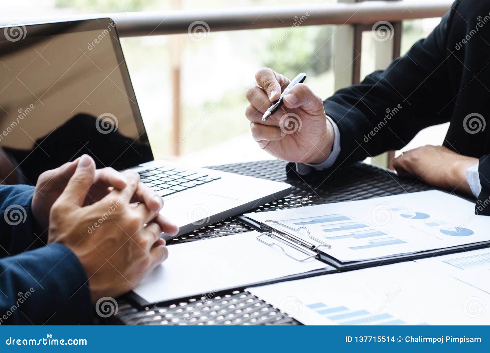 Business Executives Meeting with Data of Sales Performance at a Modern ...