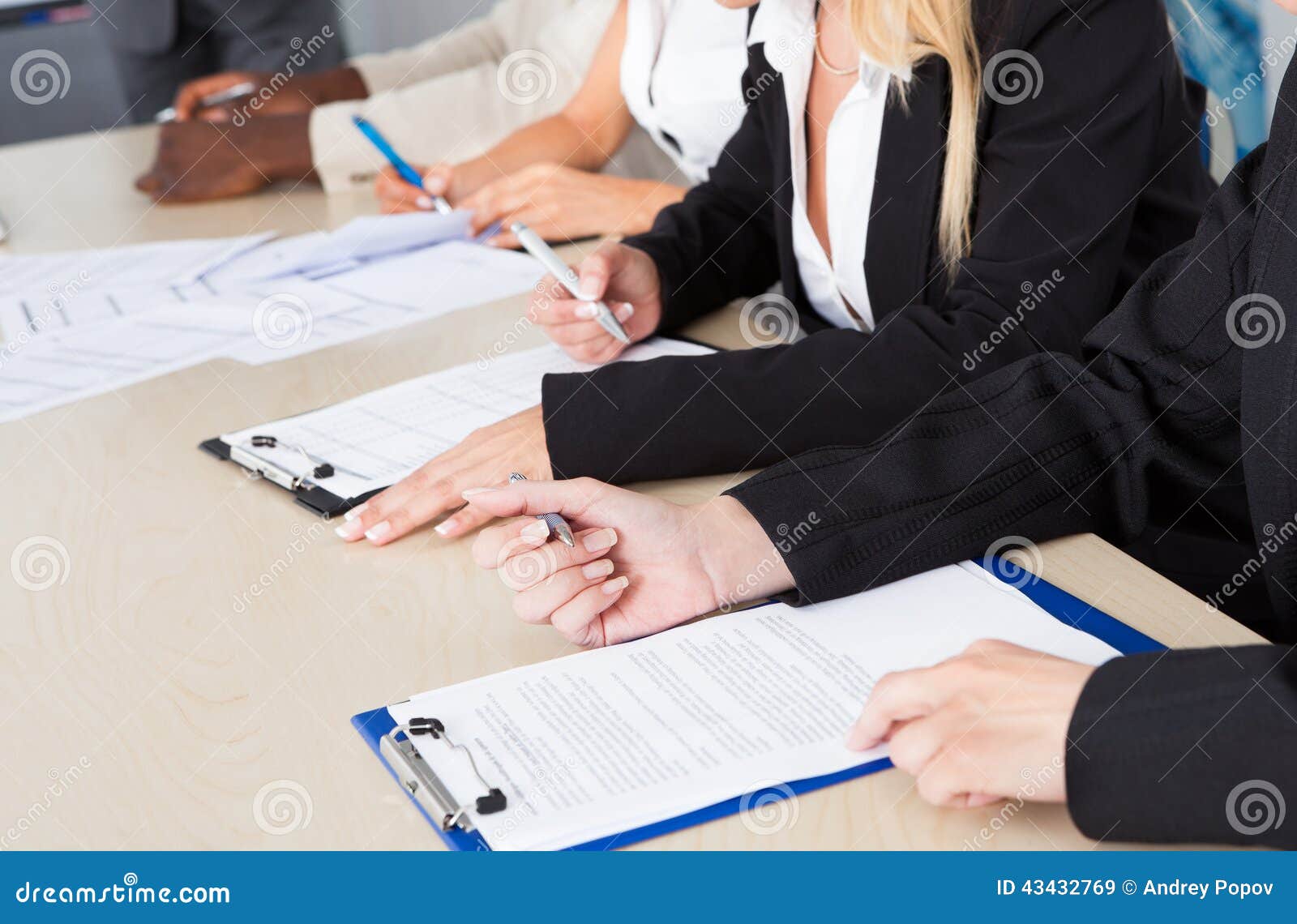 Business Executives Taking Notes during a Meeting Stock Image - Image ...