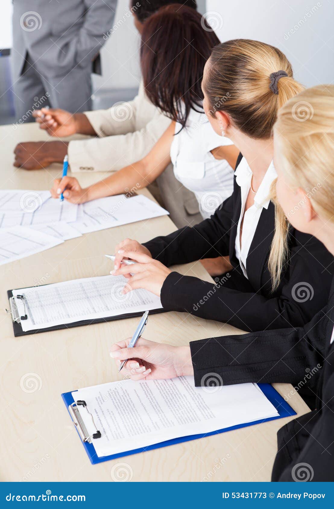 Business Executives Taking Notes during a Meeting Stock Image - Image ...