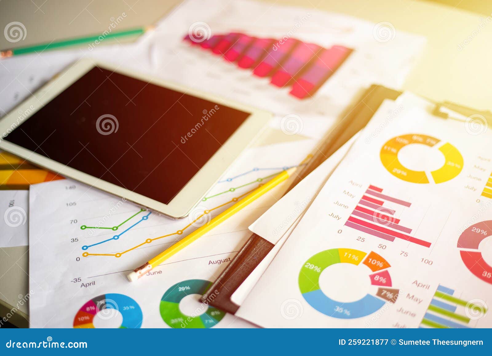 Business Financial Chart and Graphy Report on Table with Digital Tablet ...