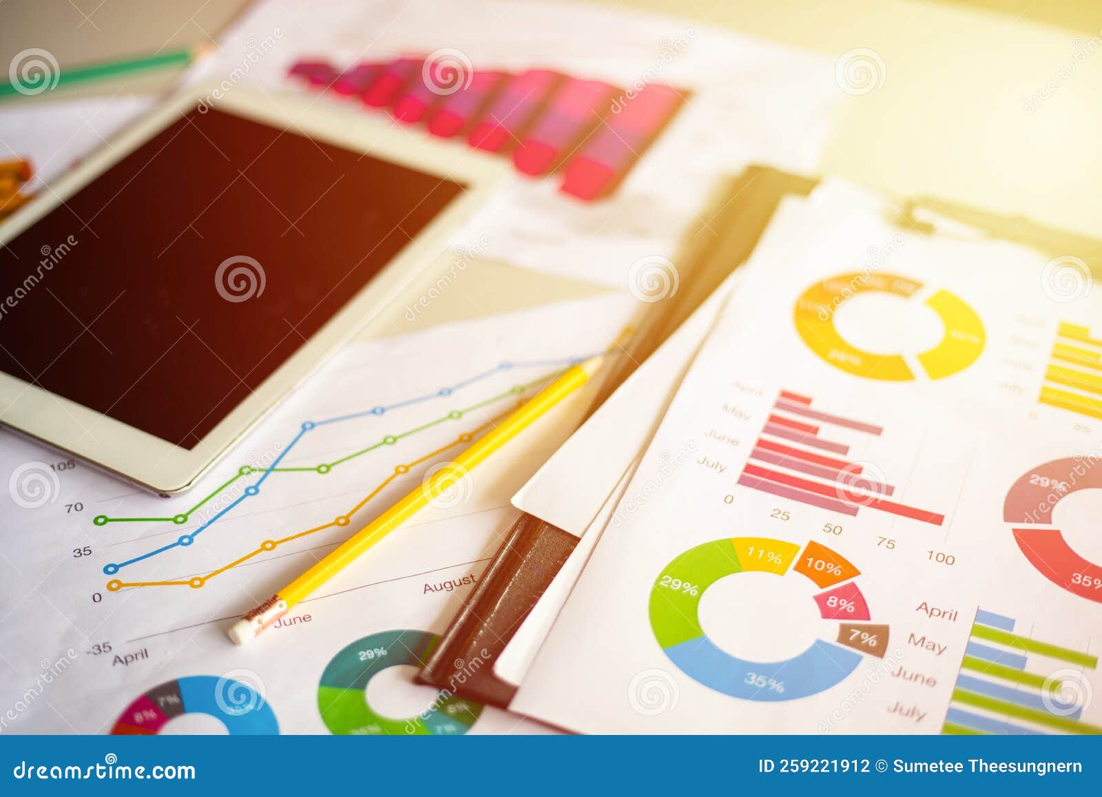 Business Financial Chart and Graphy Report on Table with Digital Tablet ...