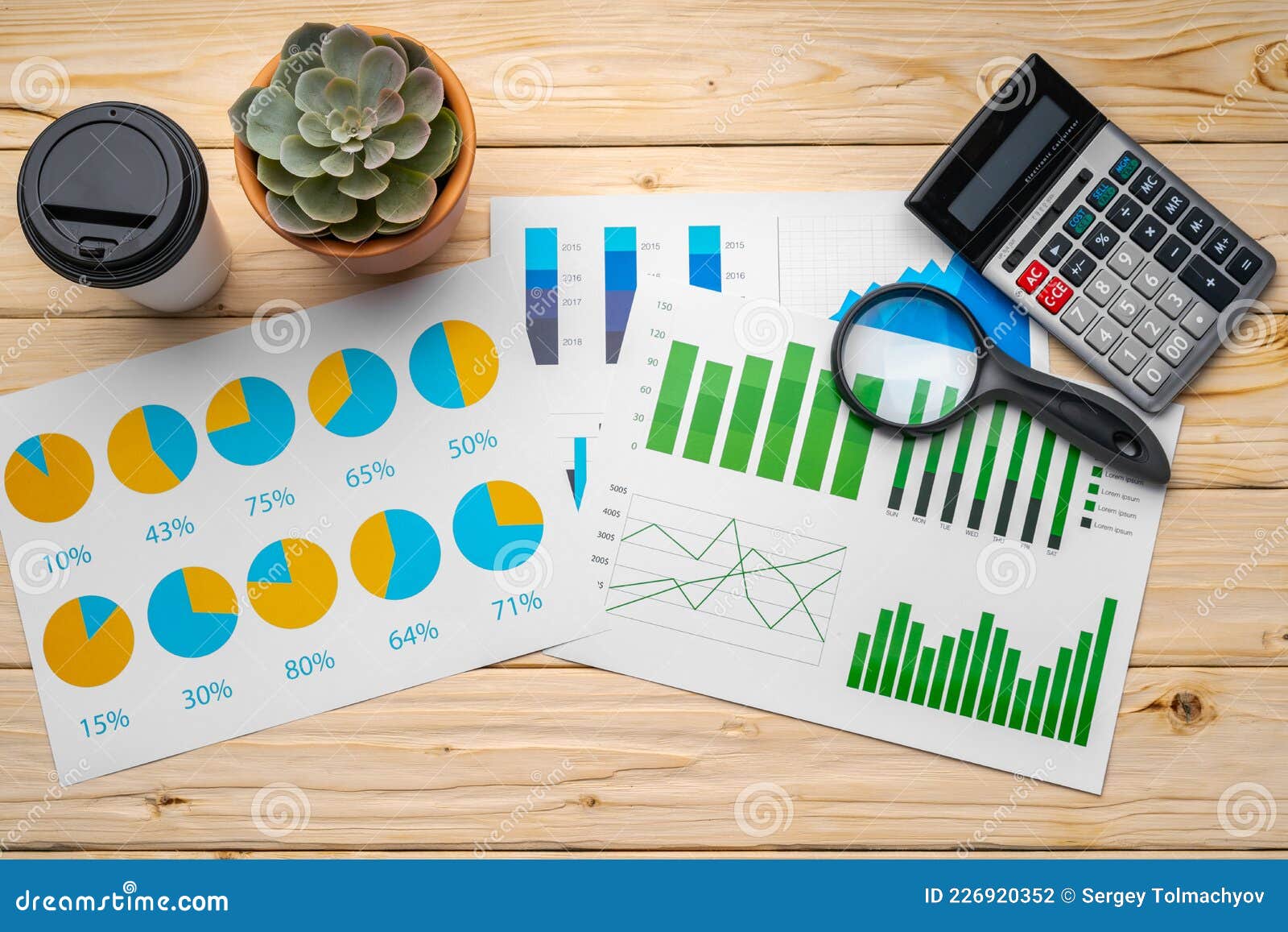 Business Graphs Paper and Calculator on Table Stock Photo - Image of ...