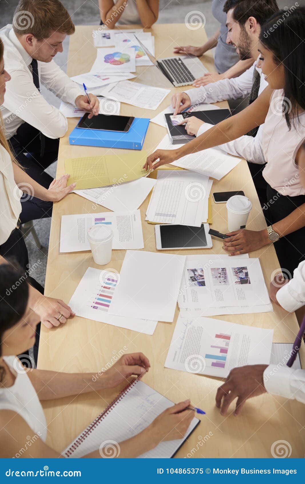 Business Group Brainstorming at a Table, Elevated Close Up Stock Image ...