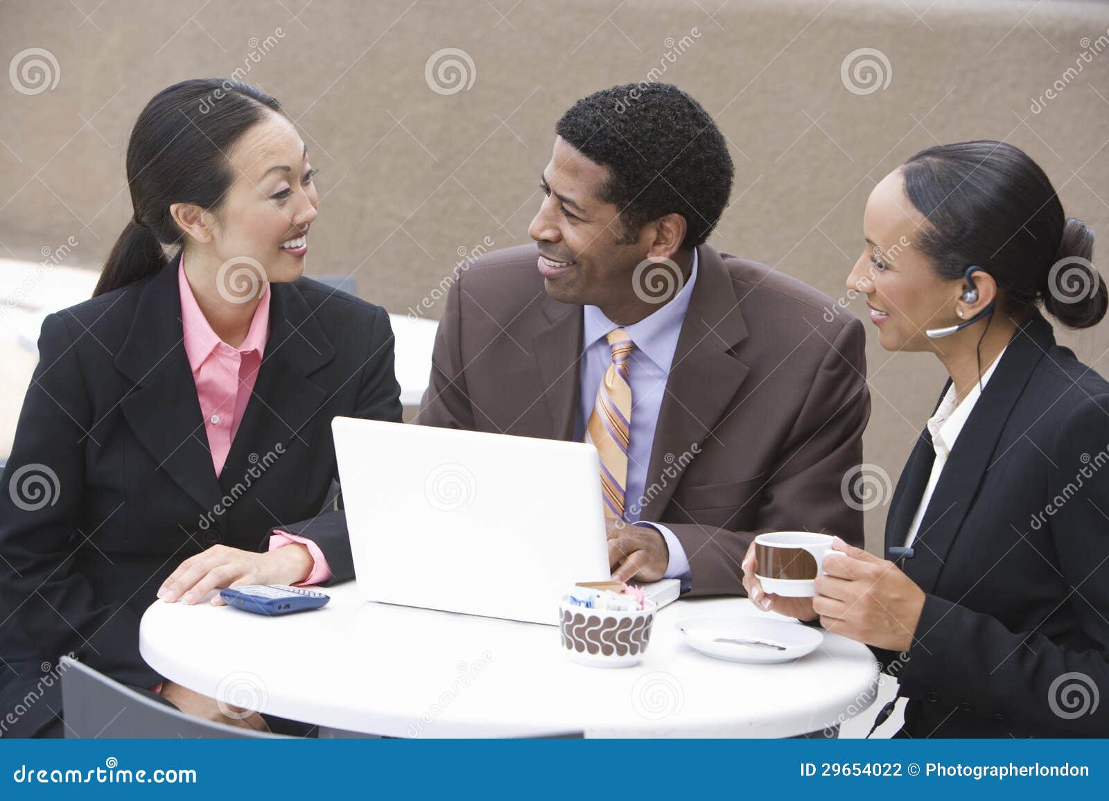 Business Group Having Discussion during Coffee Break Stock Photo ...