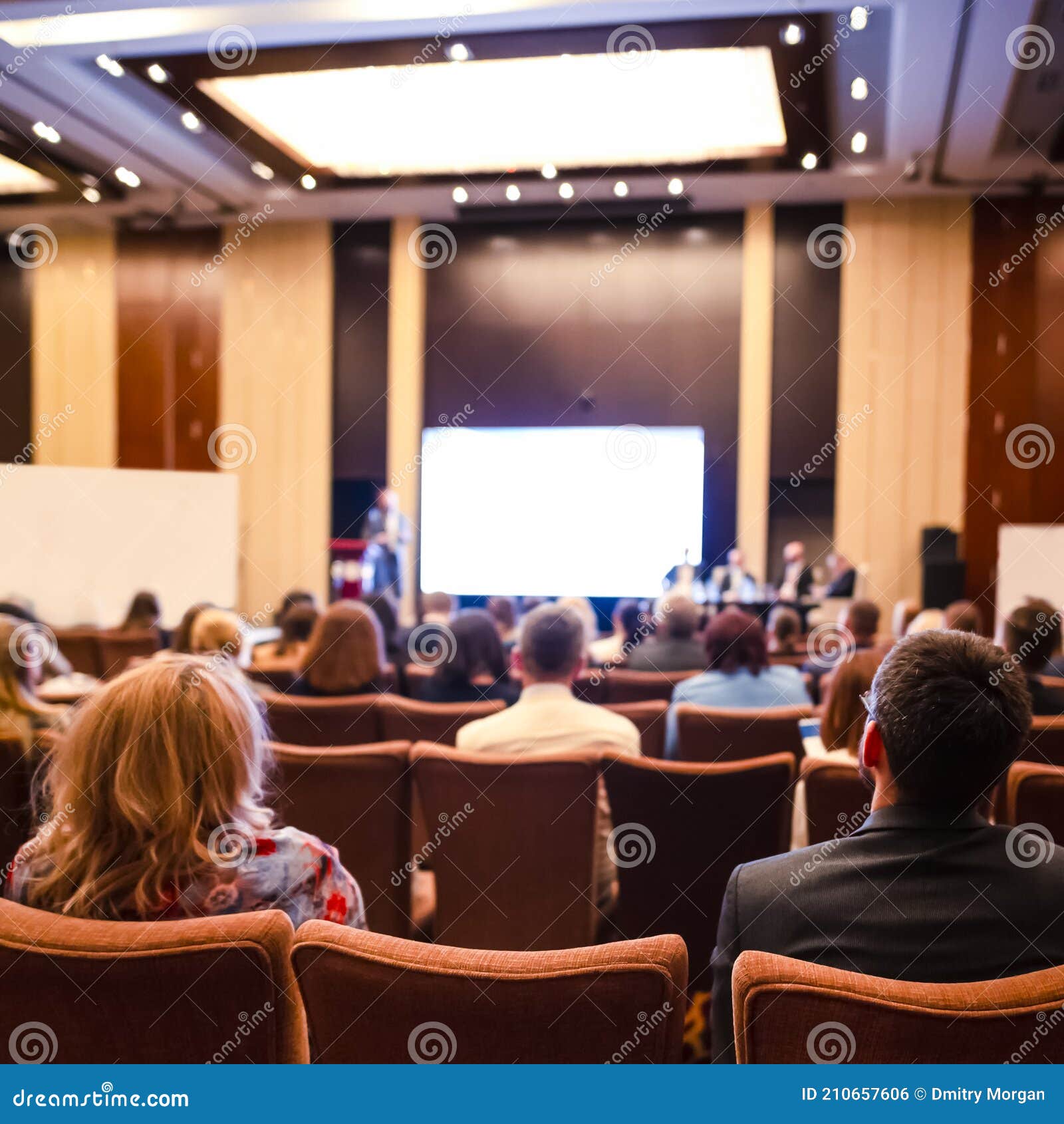 Host Speaking in Front of the Group of Business People during a ...