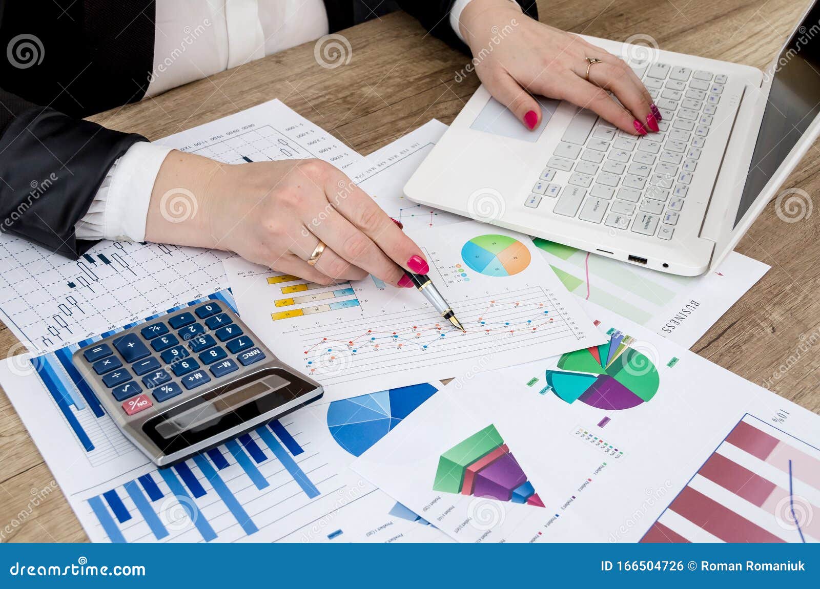 The Business Lady is Working with Charts and a Laptop Stock Photo ...