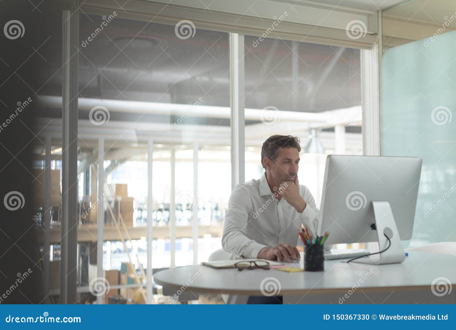 Business Male Executive Working on Computer at Desk in a Modern Office ...