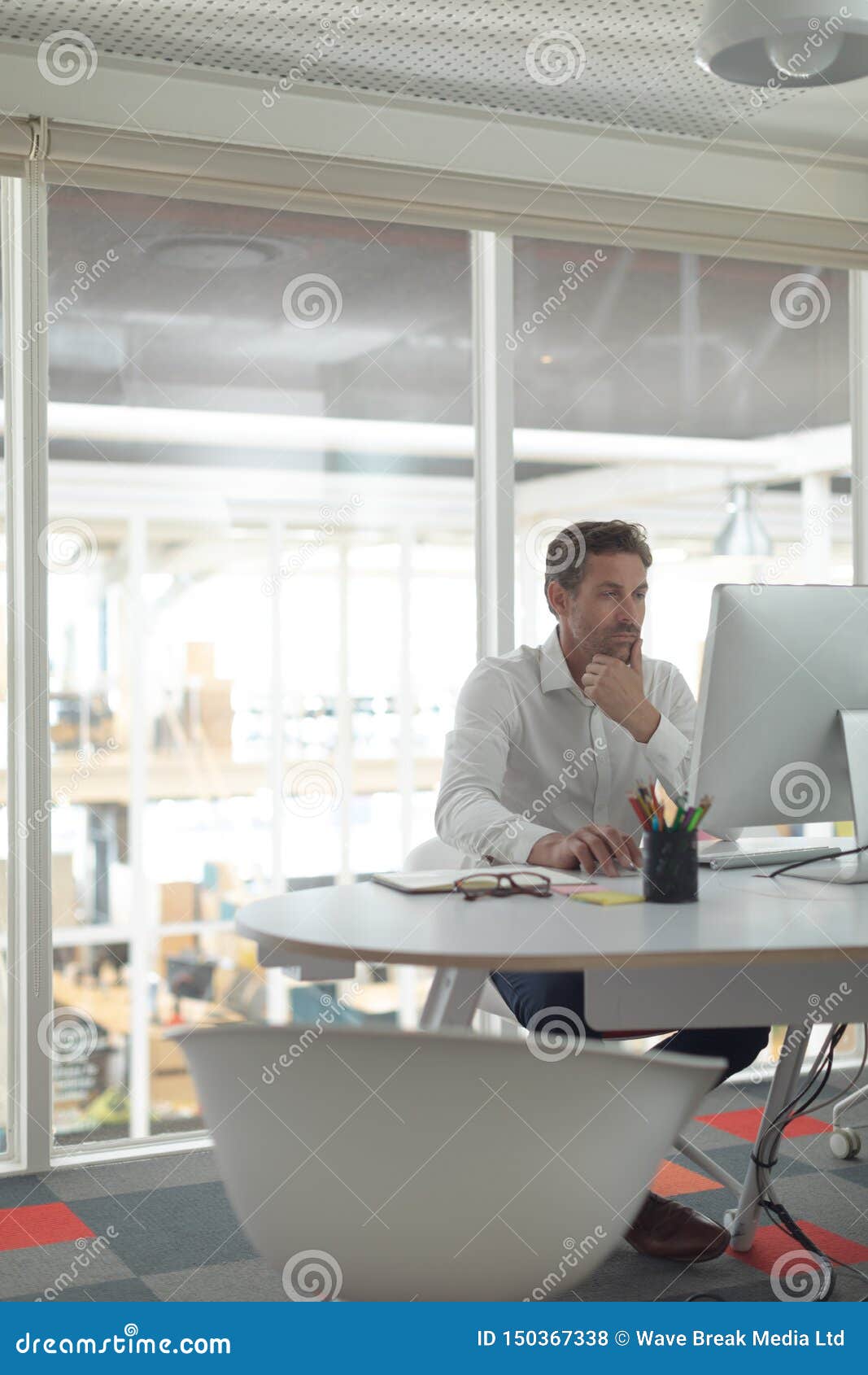 Business Male Executive Working on Computer at Desk in a Modern Office ...