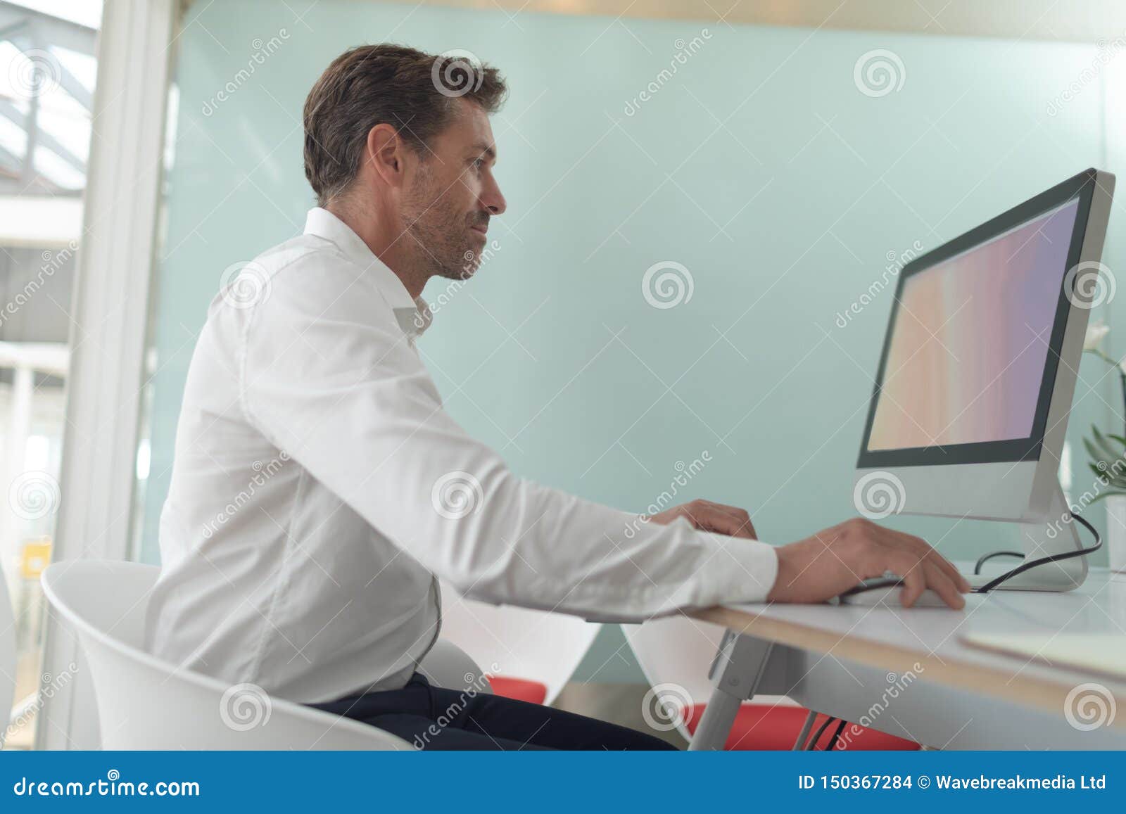 Business Male Executive Working on Computer at Desk in a Modern Office ...