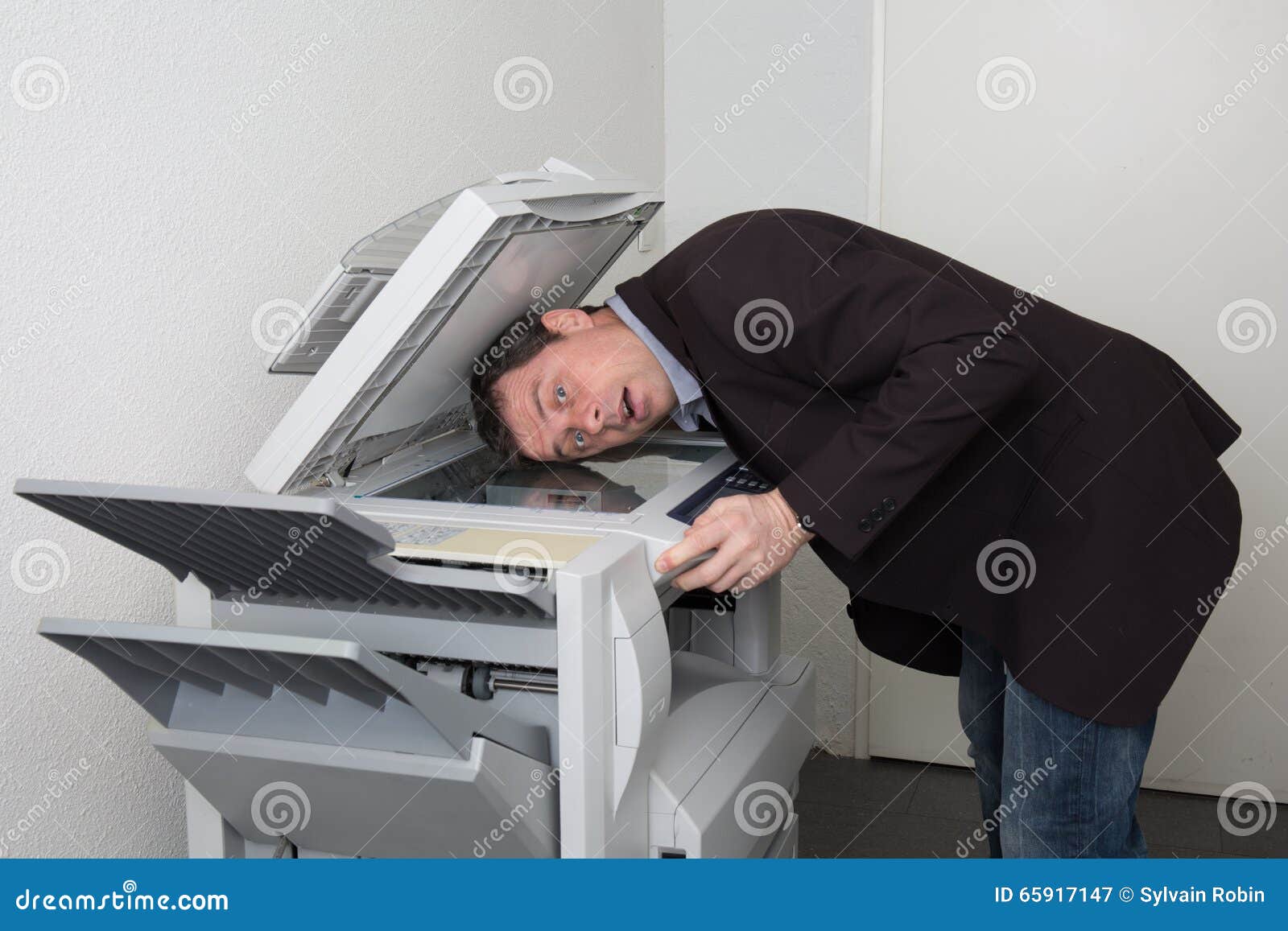Business Male in Trouble with the Copy Machine at Work Stock Image ...