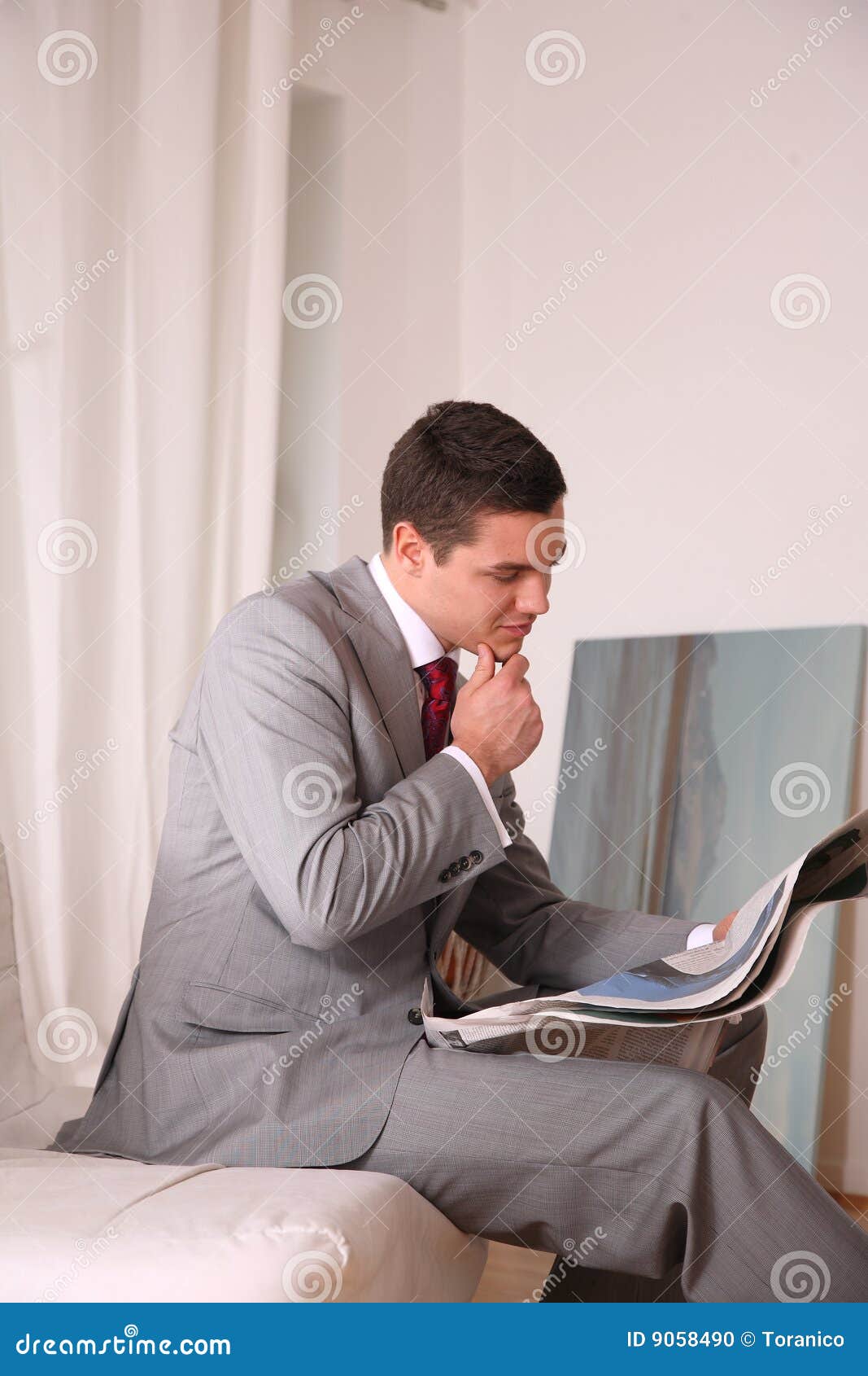 Young Man Reads Book With Interest. Concept. Student Is Intently ...