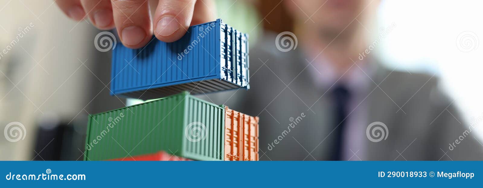 Business Man Arranging Stack of Cargo Containers on His Office Desk ...