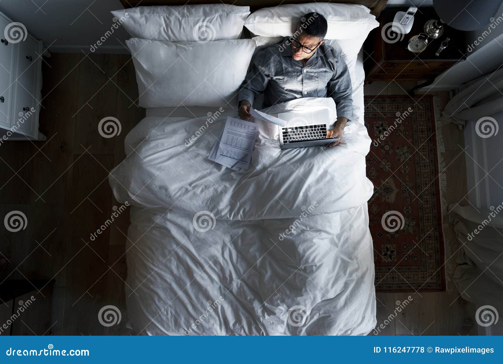 Business Man on Bed Working at Night Stock Photo - Image of bedding ...