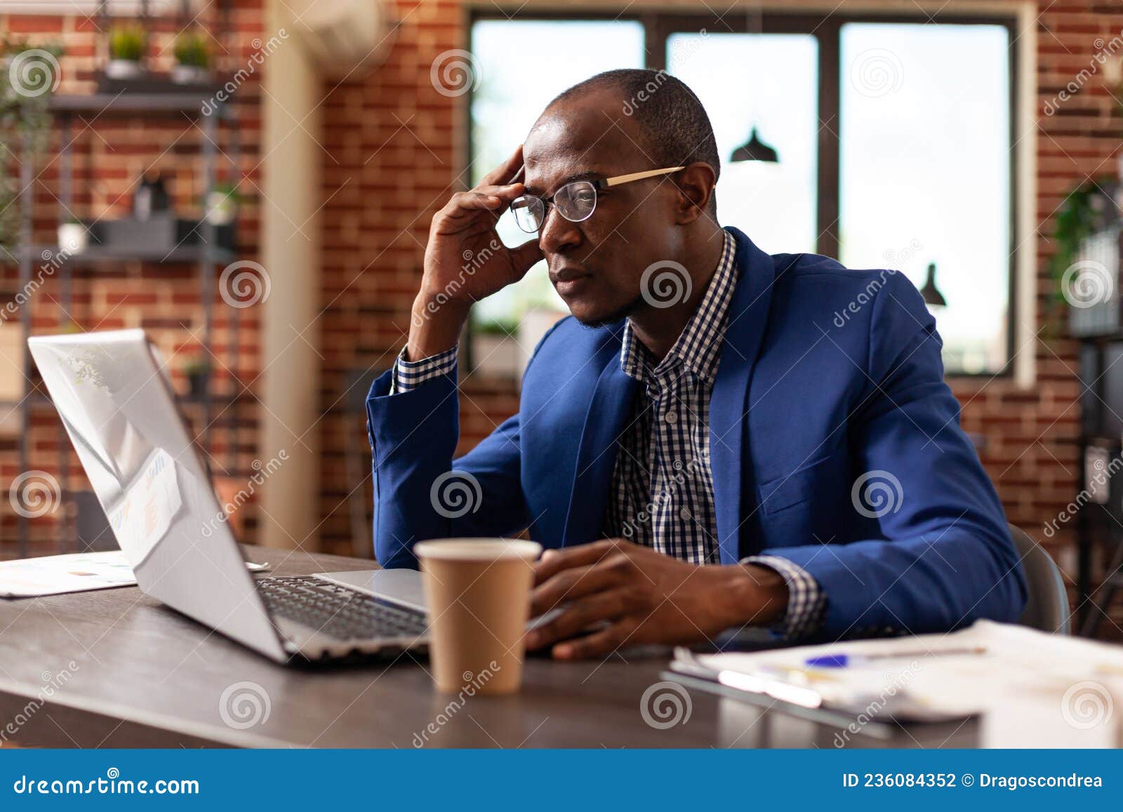 Business Man Brainstorming Solution and Working with Laptop on ...