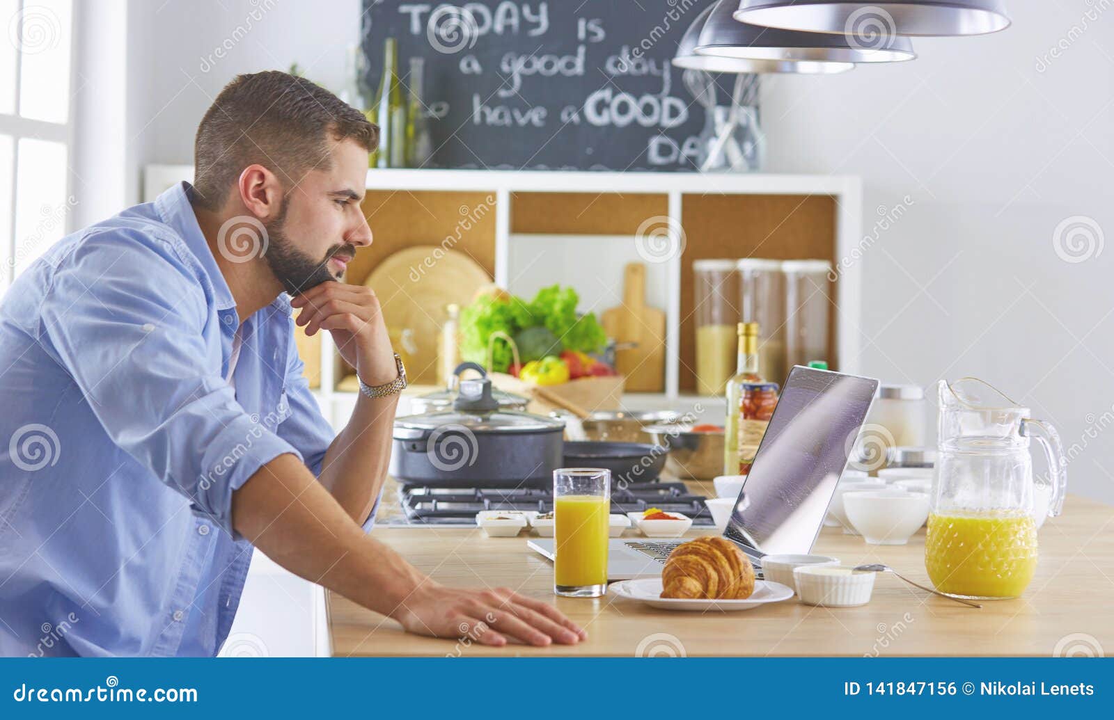 A Business Man Breakfasts with Notebook and Juice Stock Photo - Image ...