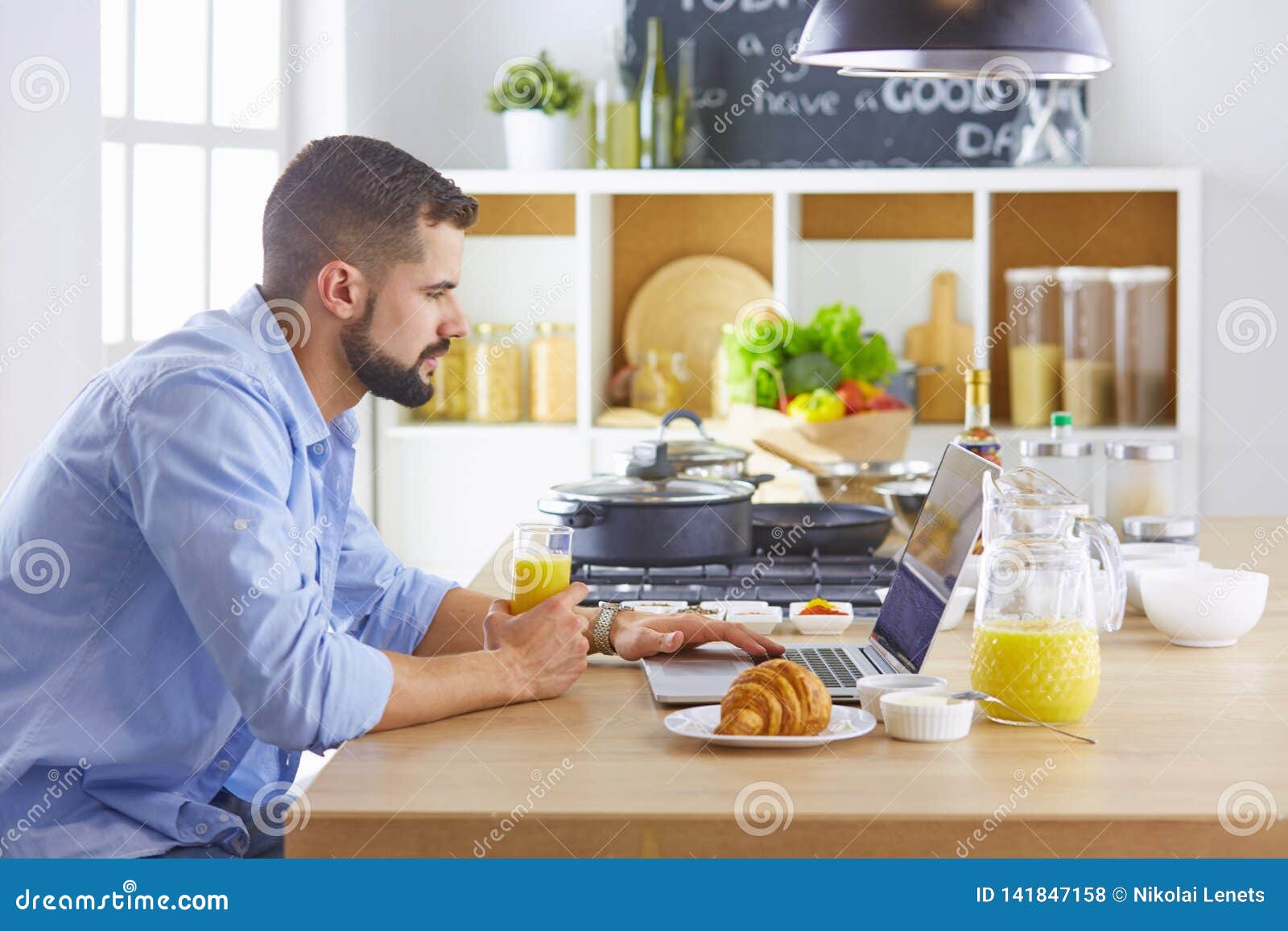 A Business Man Breakfasts with Notebook and Juice Stock Photo - Image ...