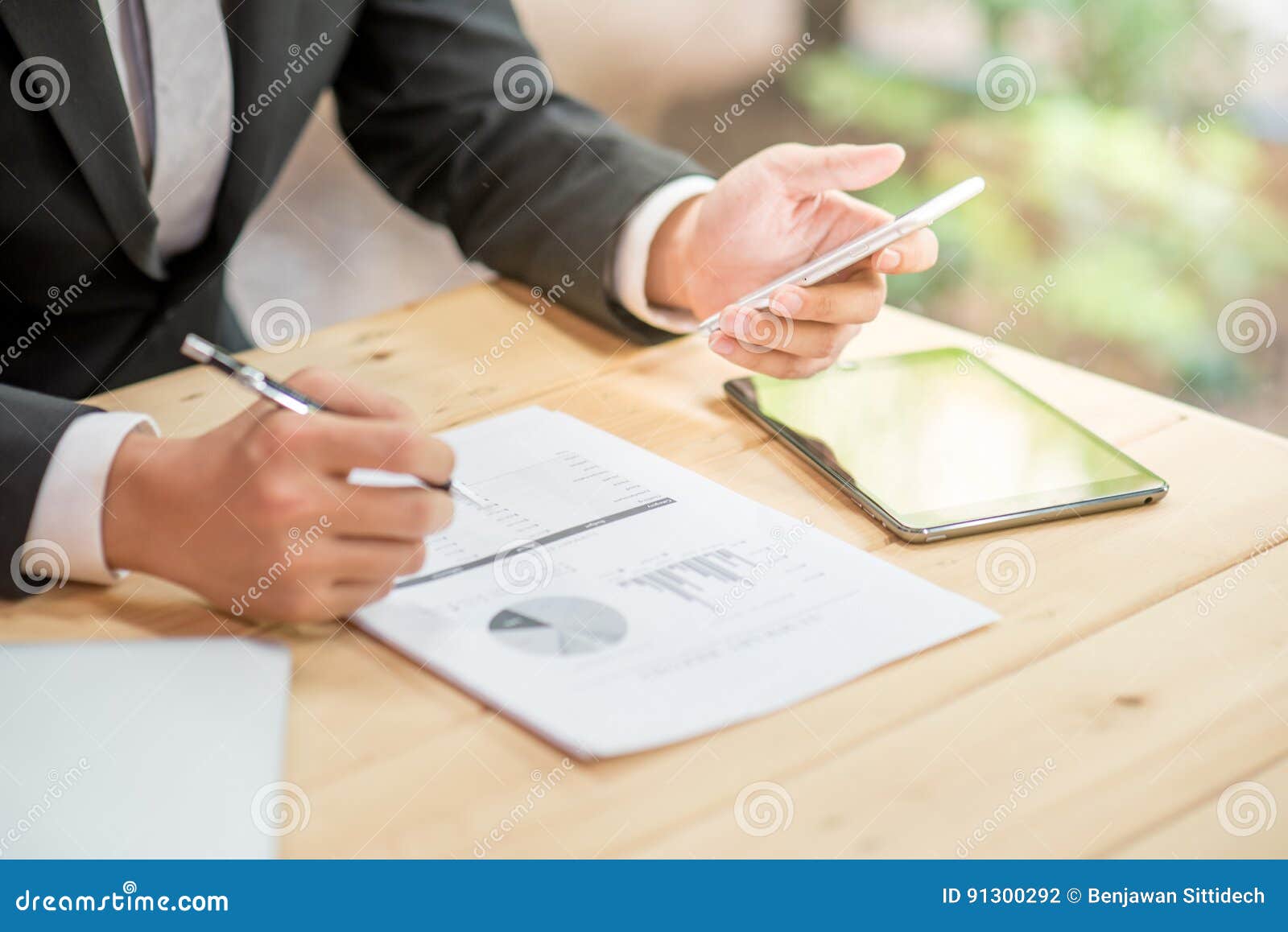 Business Man Checking Report and Using Smartphone Stock Photo - Image ...
