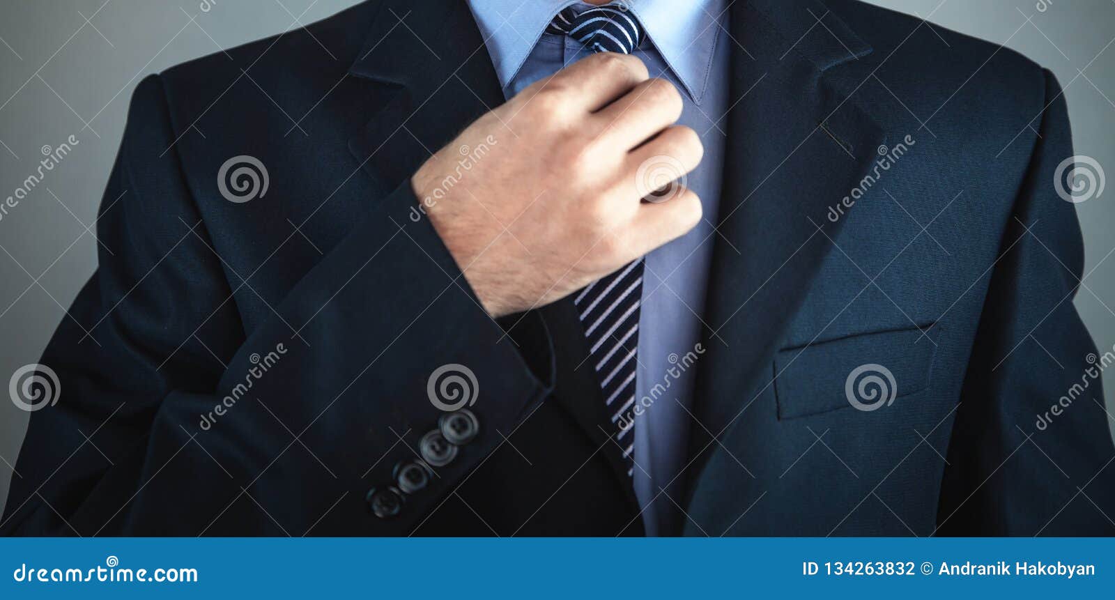 Business Man Fixing His Tie Stock Photo - Image of elegant, caucasian ...