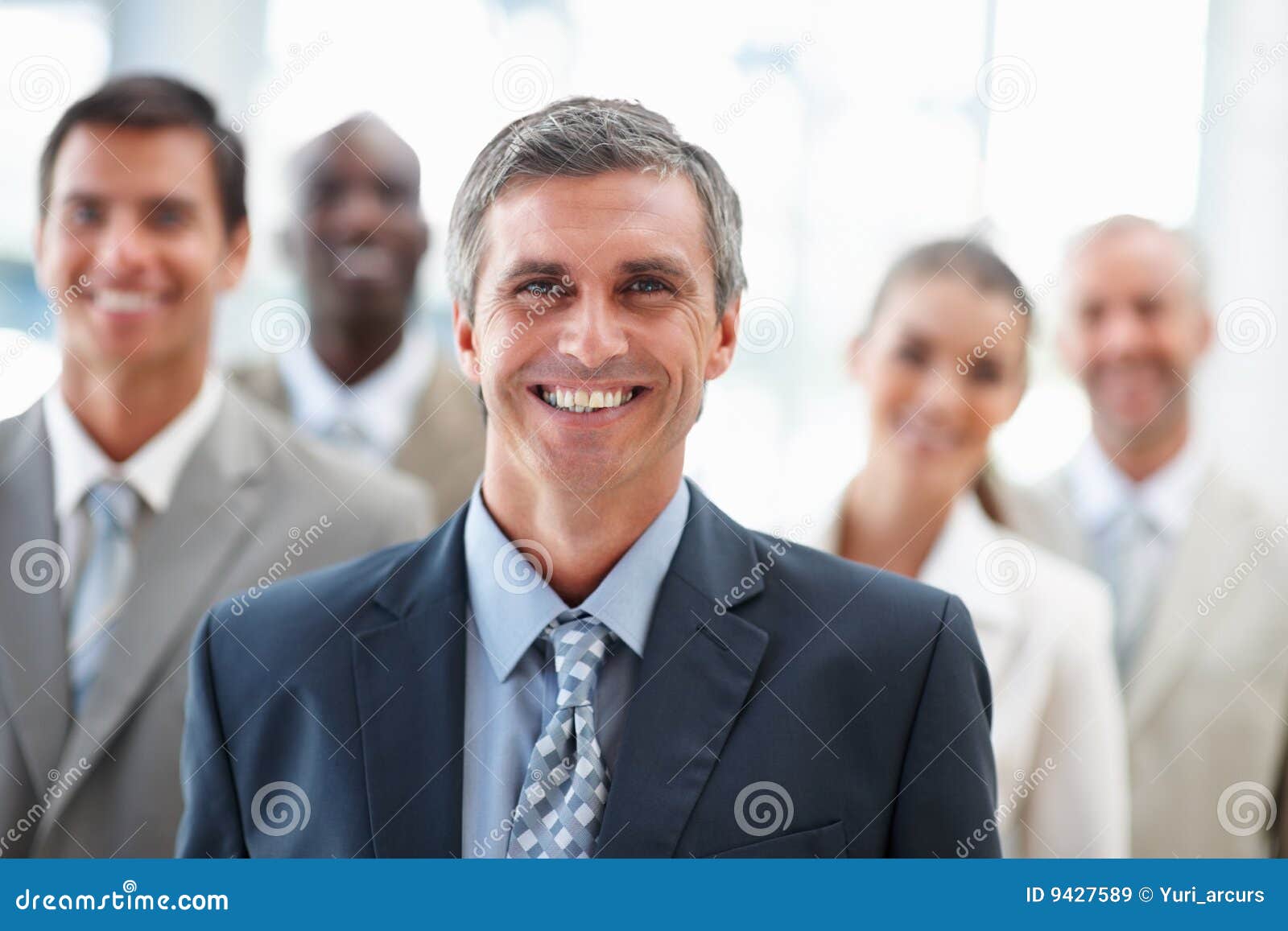 Business Man with Group of Colleagues at the Back Stock Image - Image ...