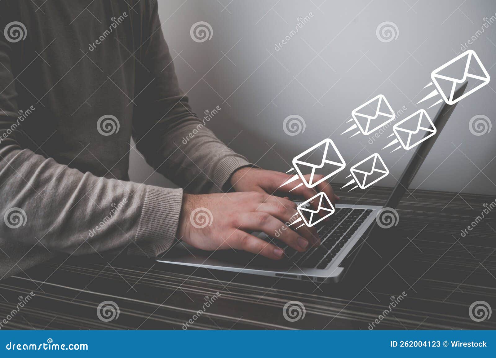 Man Sending and Receiving Emails on His Laptop on a Wooden Desk Indoors ...
