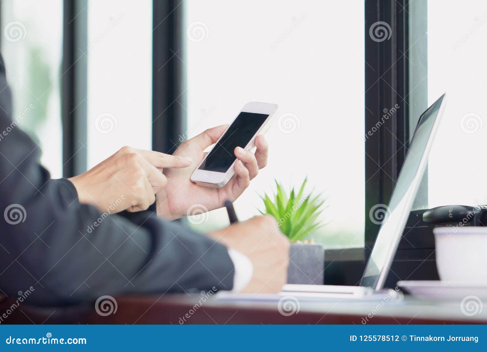 Business Man Hand Working on Smart Phone and Laptop Computer Stock ...