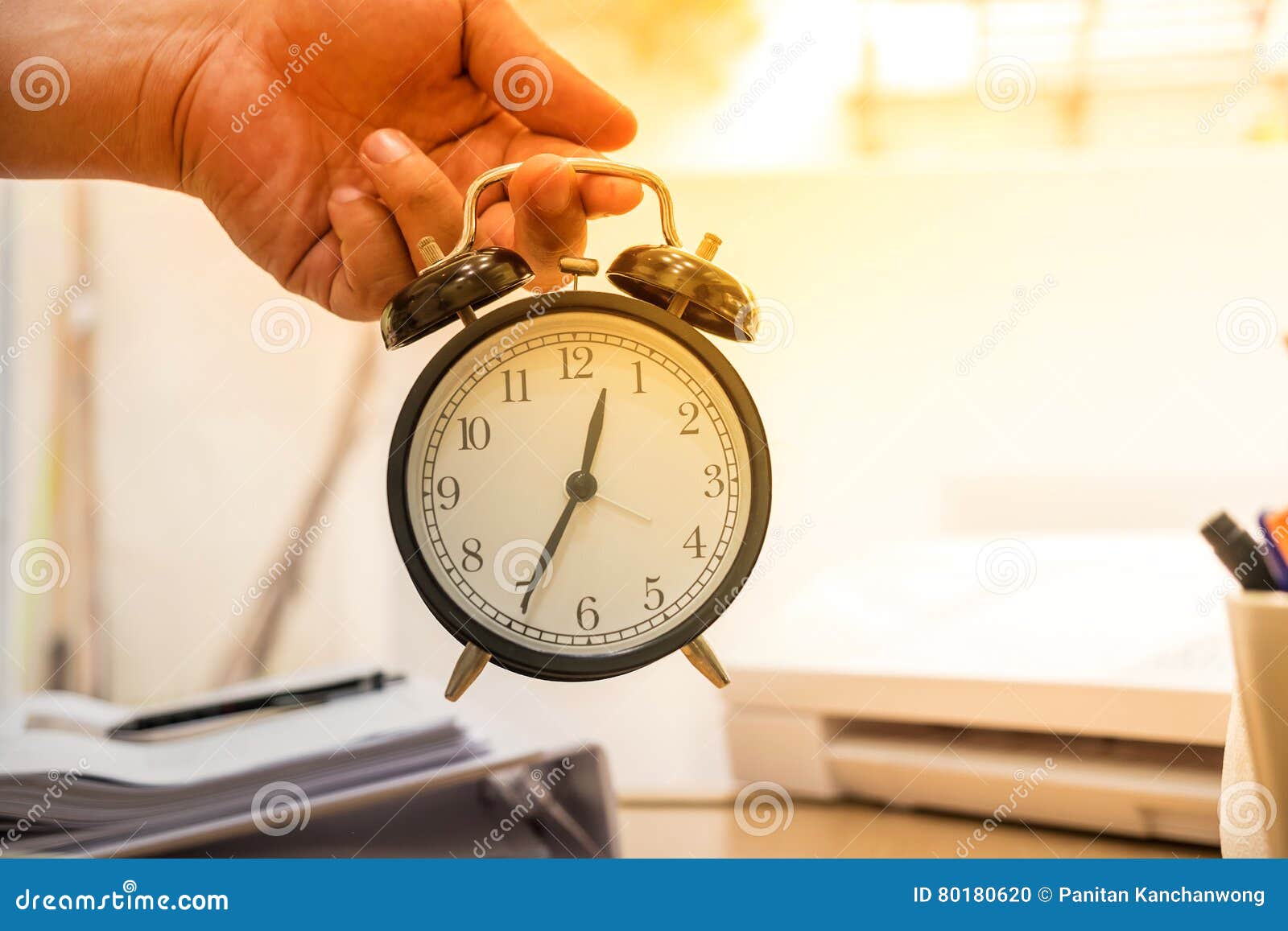 Business man holding clock stock photo. Image of clock - 80180620