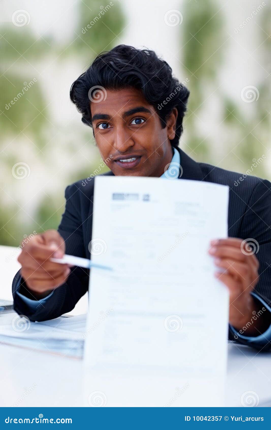 Business Man Holding a Form To Be Filled at Work Stock Image - Image of ...