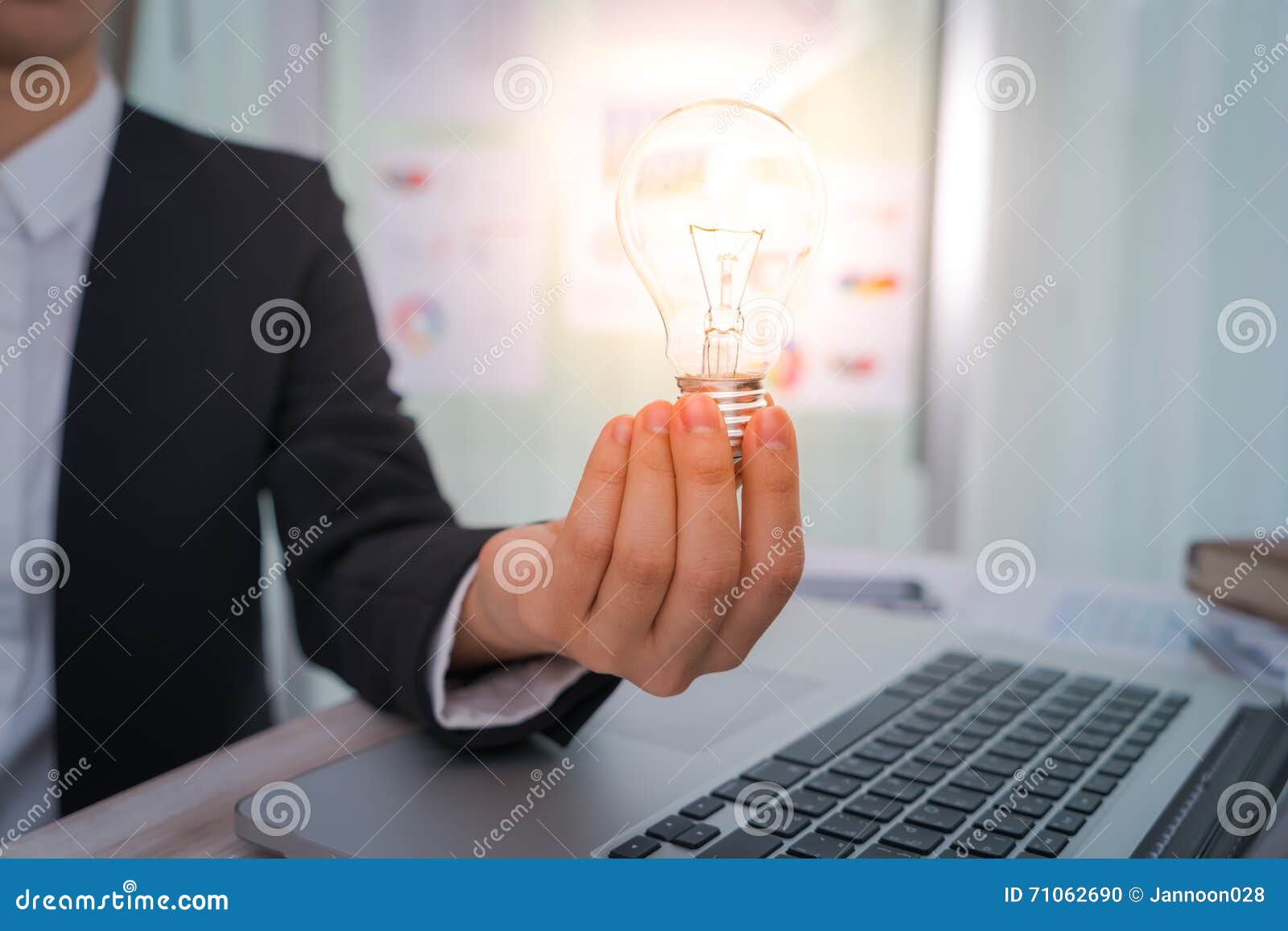 Business Man Holding Light Bulb. Stock Photo - Image of industry ...