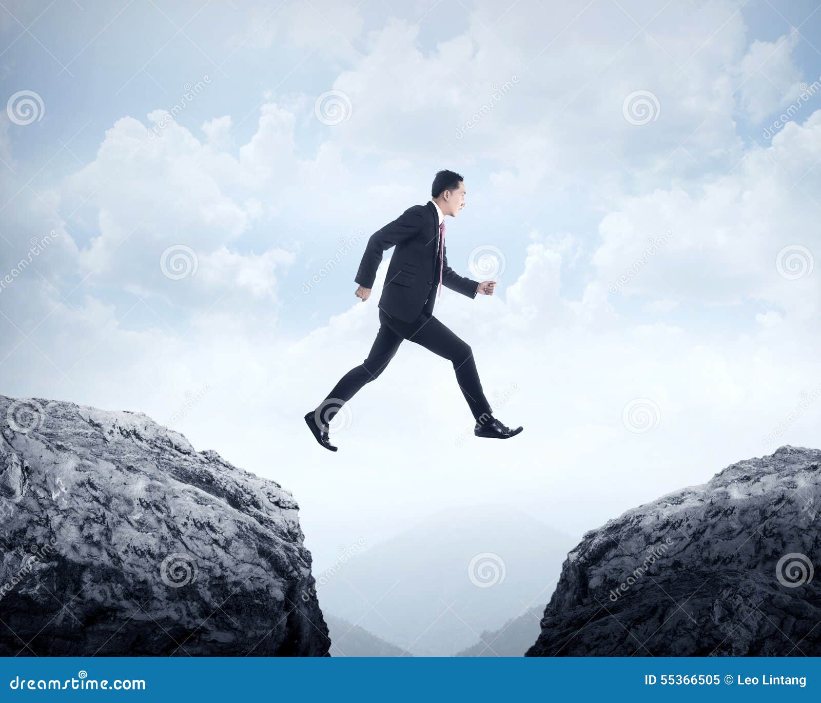 Business Man Jumping Across Hill Stock Image - Image of risk ...