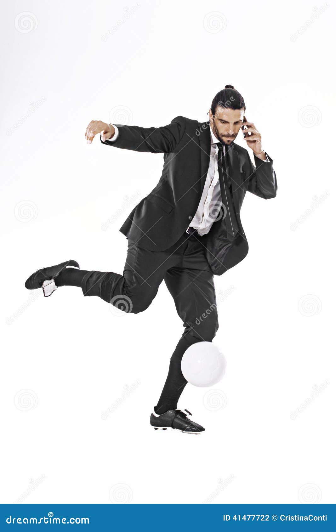 Business Man Kicking a Ball while Calling in Office Stock Photo - Image ...