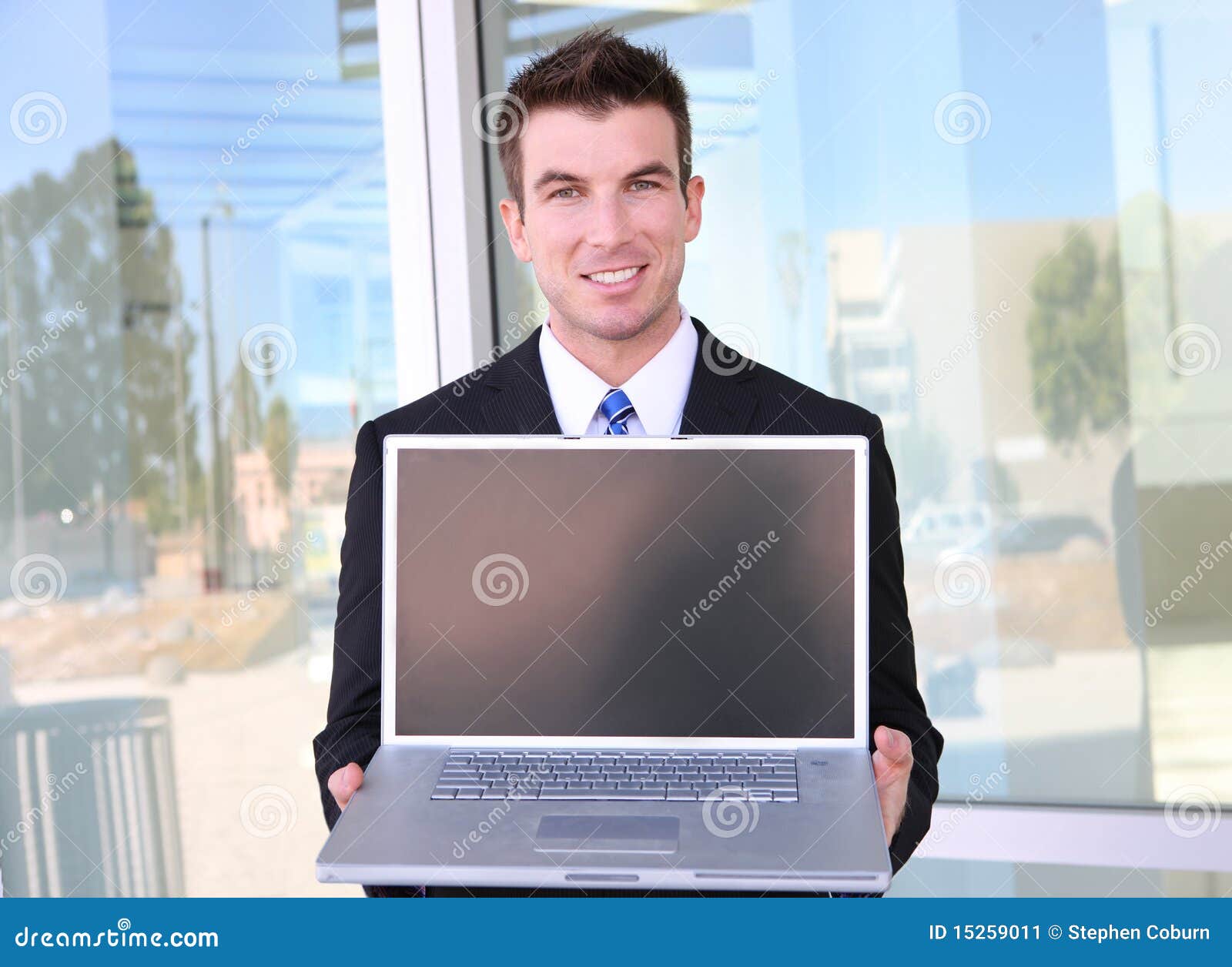 Business Man with Laptop stock image. Image of casual - 15259011