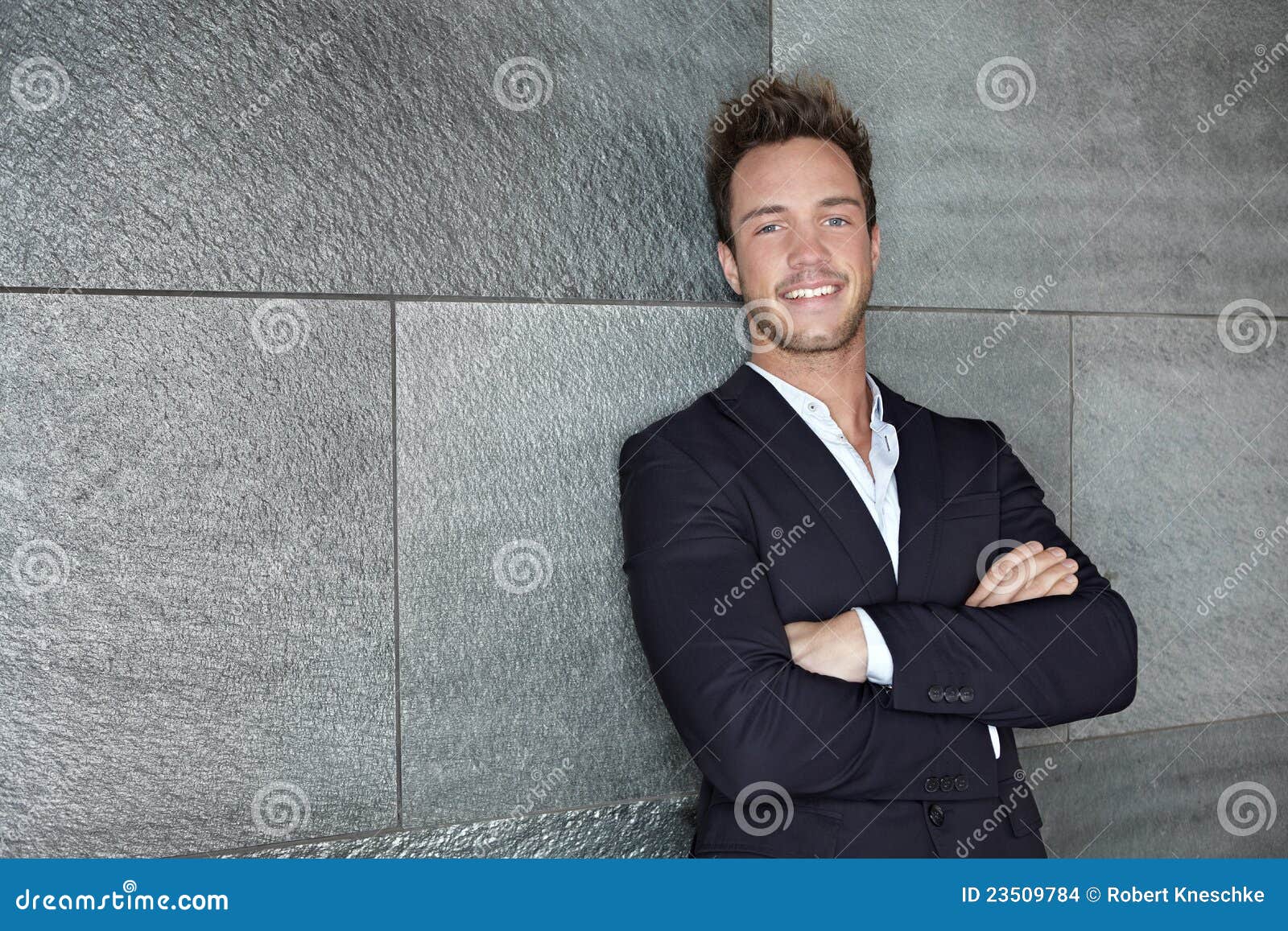 Business Man Leaning on Wall Stock Photo - Image of happy, beauty: 23509784