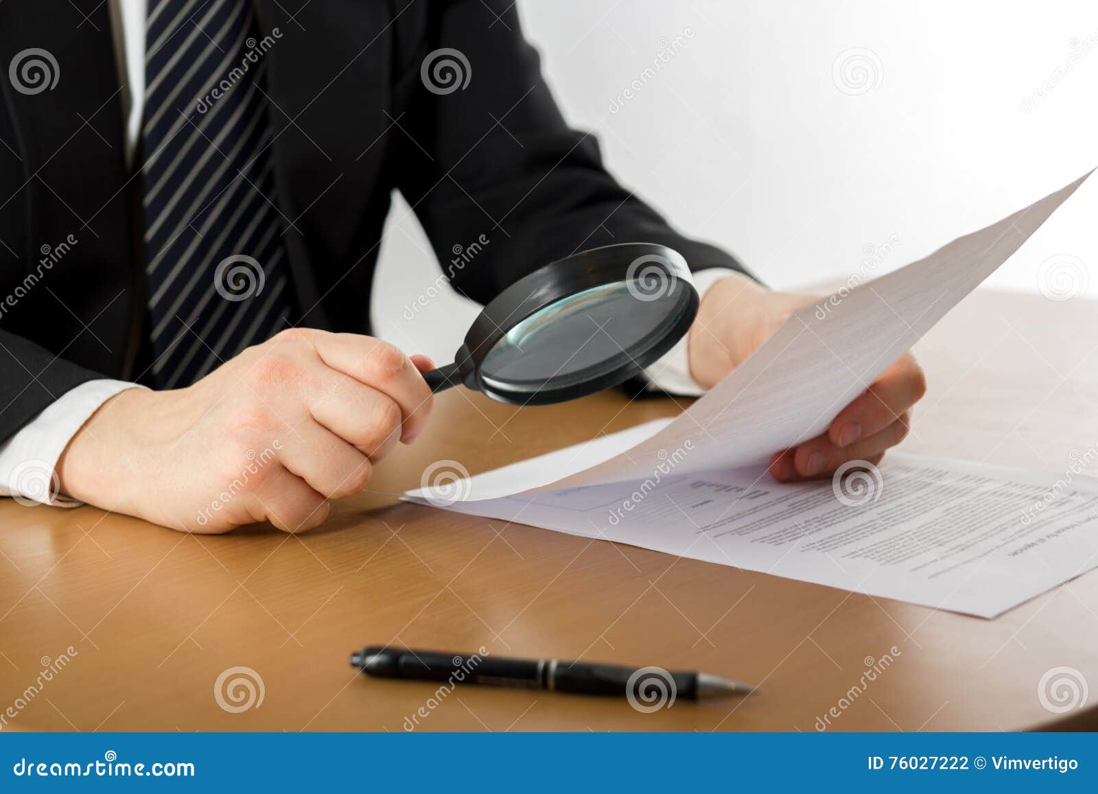 Business Man Looking in Documents with Magnifying Glass. Stock Photo ...